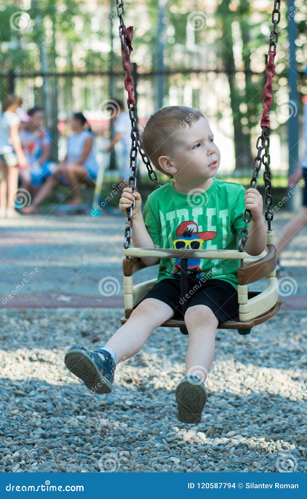 The boy is riding a swing stock photo. Image of expression - 120587794