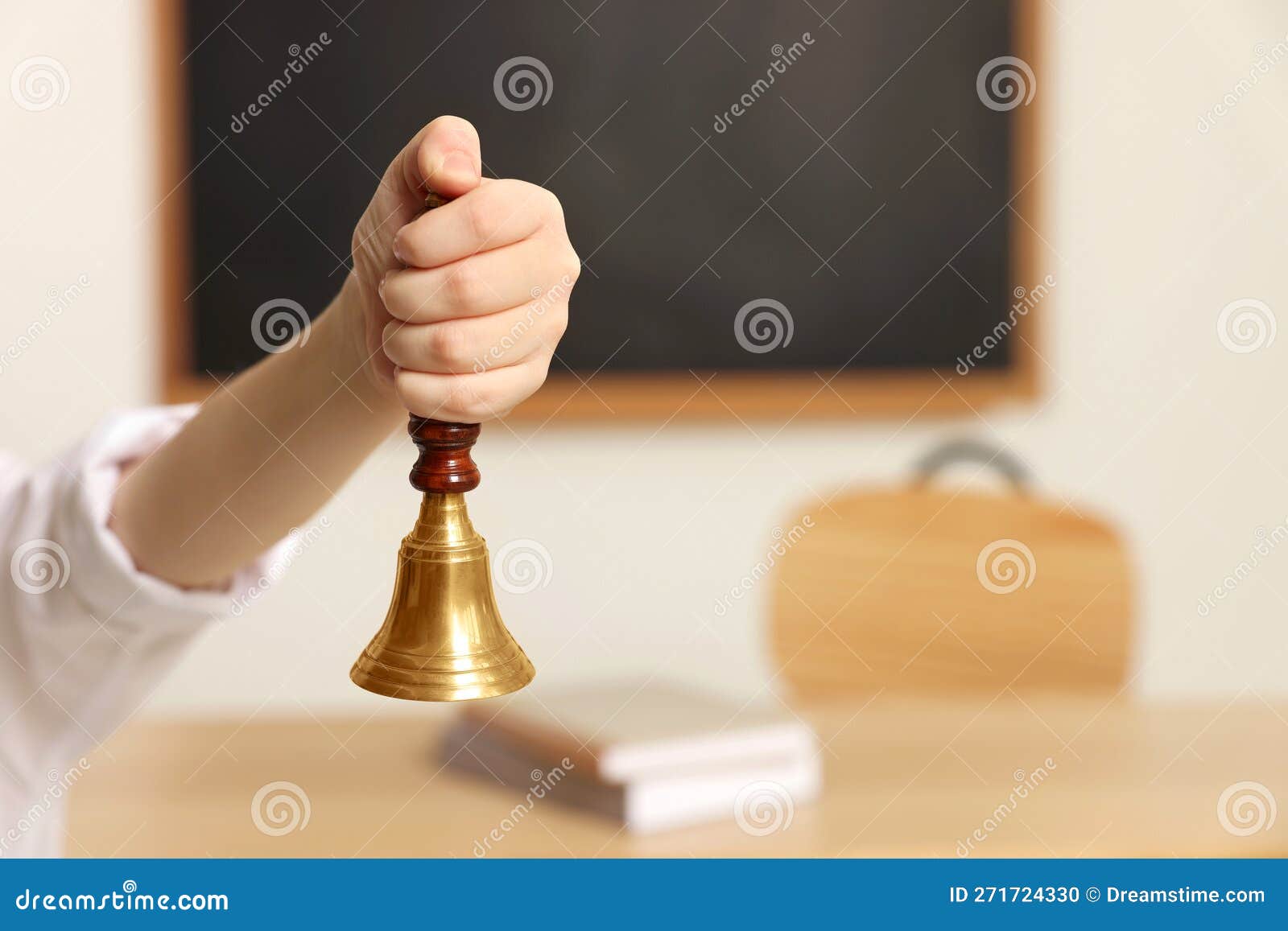 Boy Ringing School Bell in Classroom, Closeup. Space for Text Stock ...
