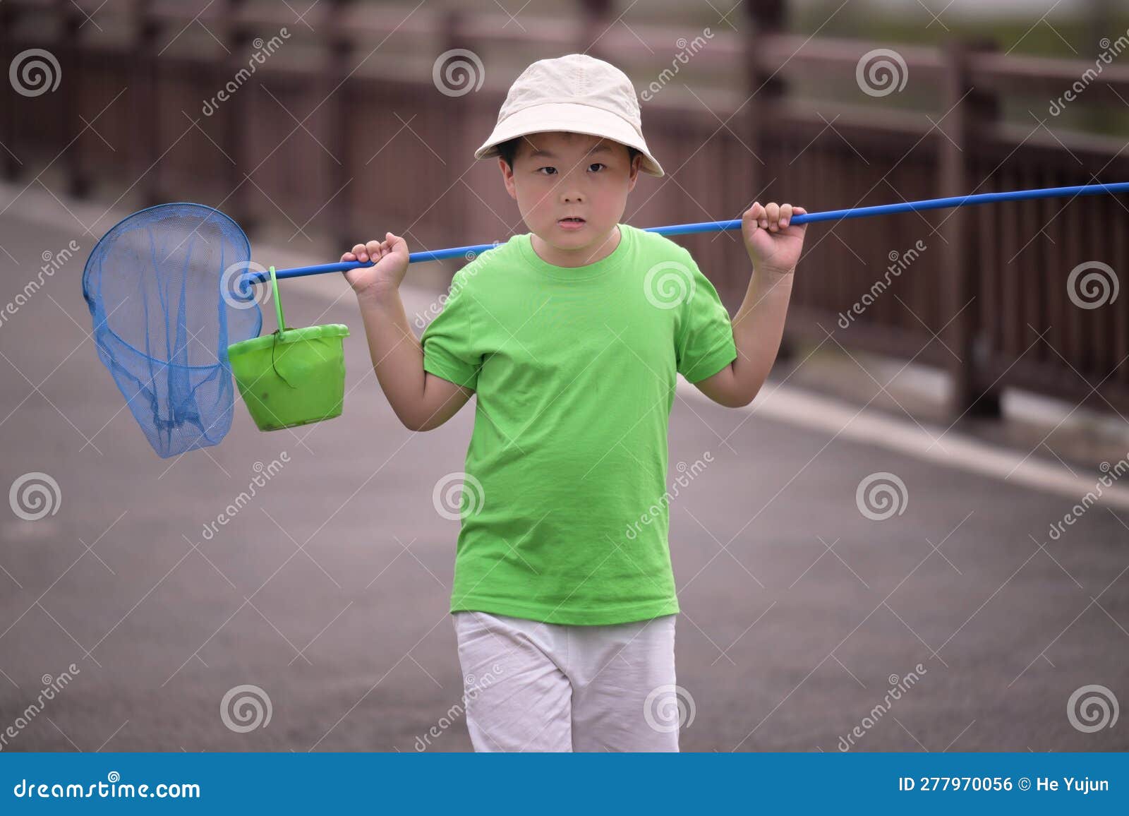Boy Catching Fish with a Fishing Net Stock Photo - Image of waterbird ...
