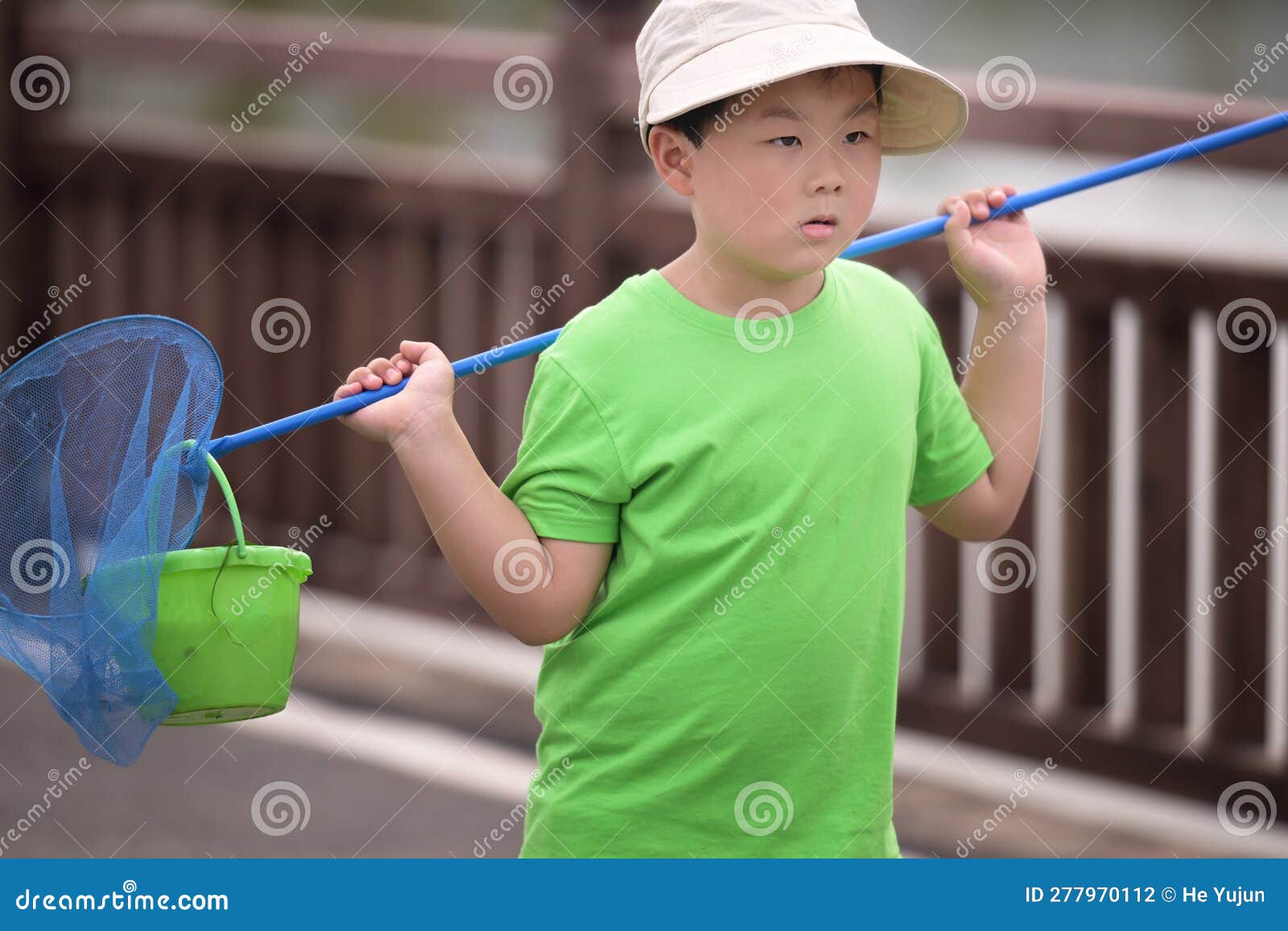 Boy Catching Fish with a Fishing Net Stock Photo - Image of waterway ...