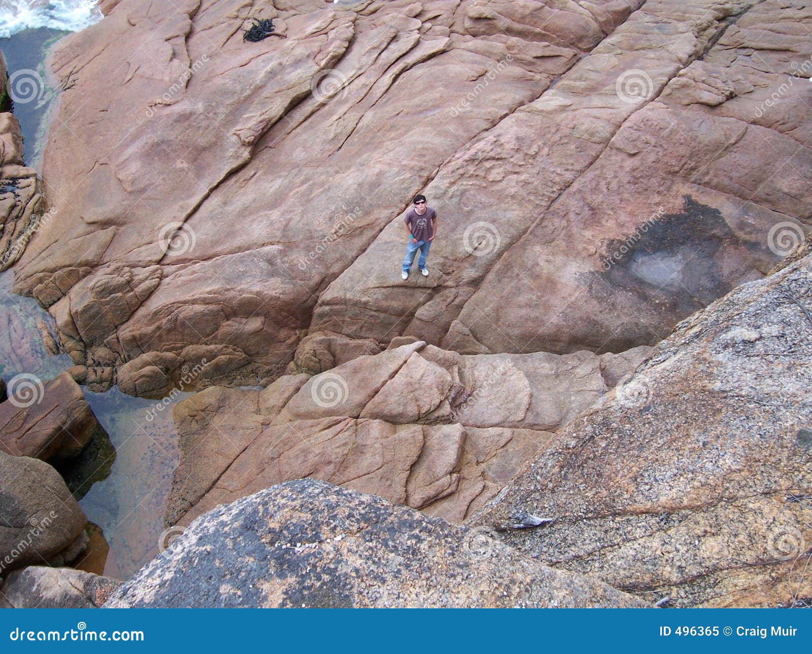 Boy on rocks stock image. Image of geology, cliff, elevated - 496365
