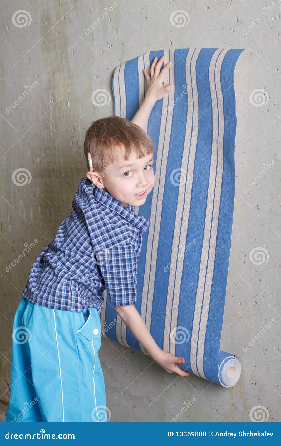 Boy with Roll of Wallpaper Near Wall Stock Photo - Image of childhood ...