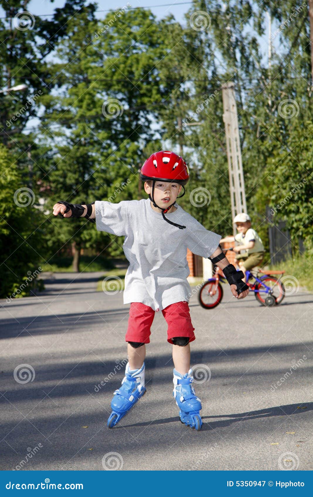 Boy roller - blading stock image. Image of handsome, laughing - 5350947