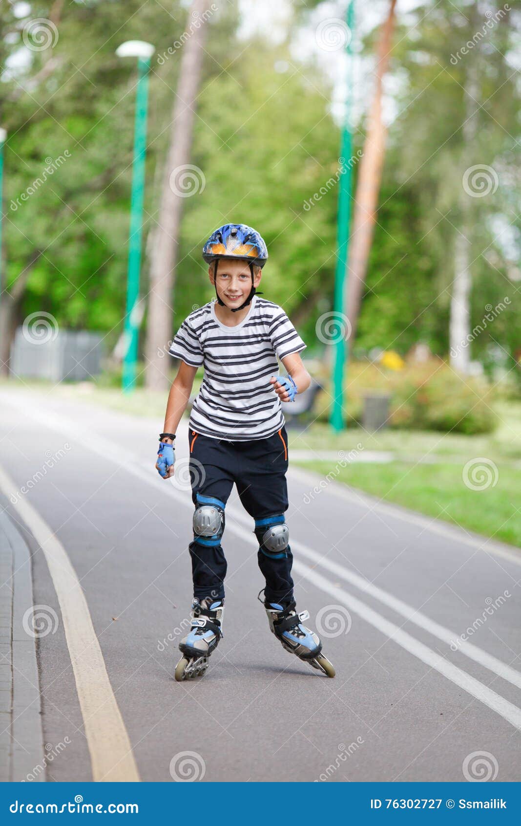 Boy on roller-skates stock image. Image of childhood - 76302727