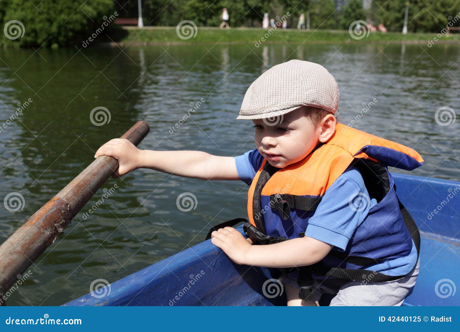 Boy rowing boat stock image. Image of pond, canoeing - 42440125
