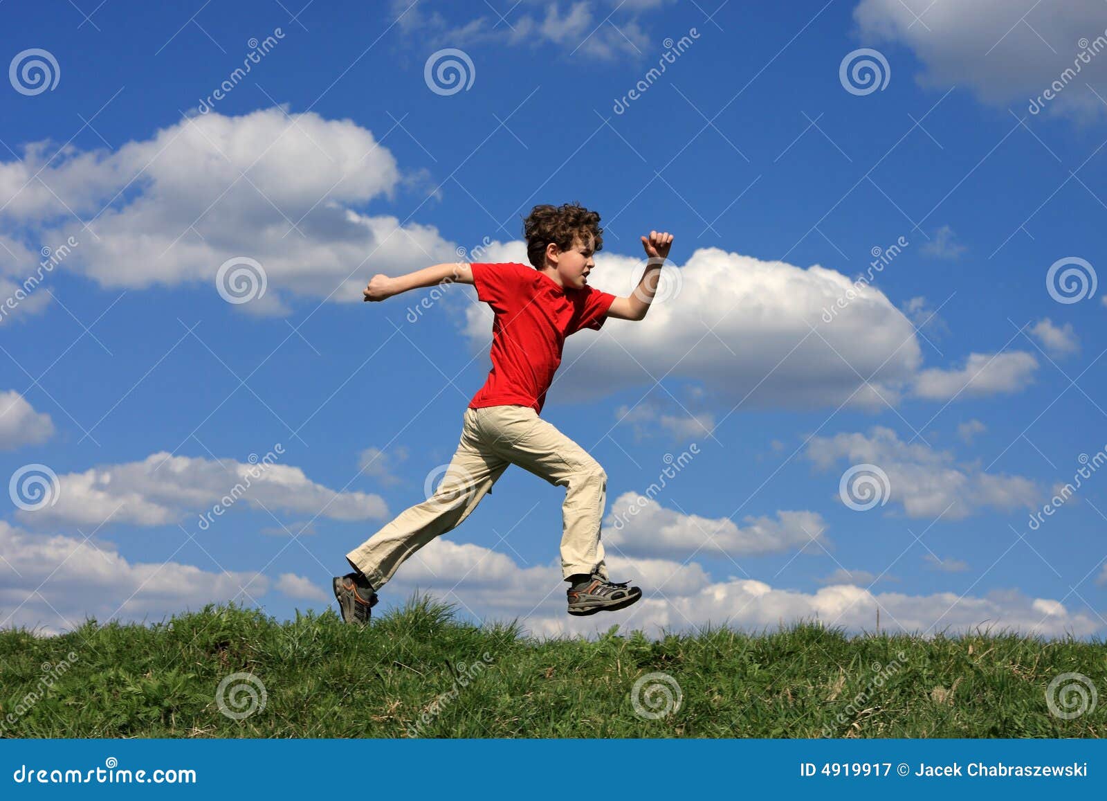Boy running stock image. Image of cloudscape, happy, grass - 4919917