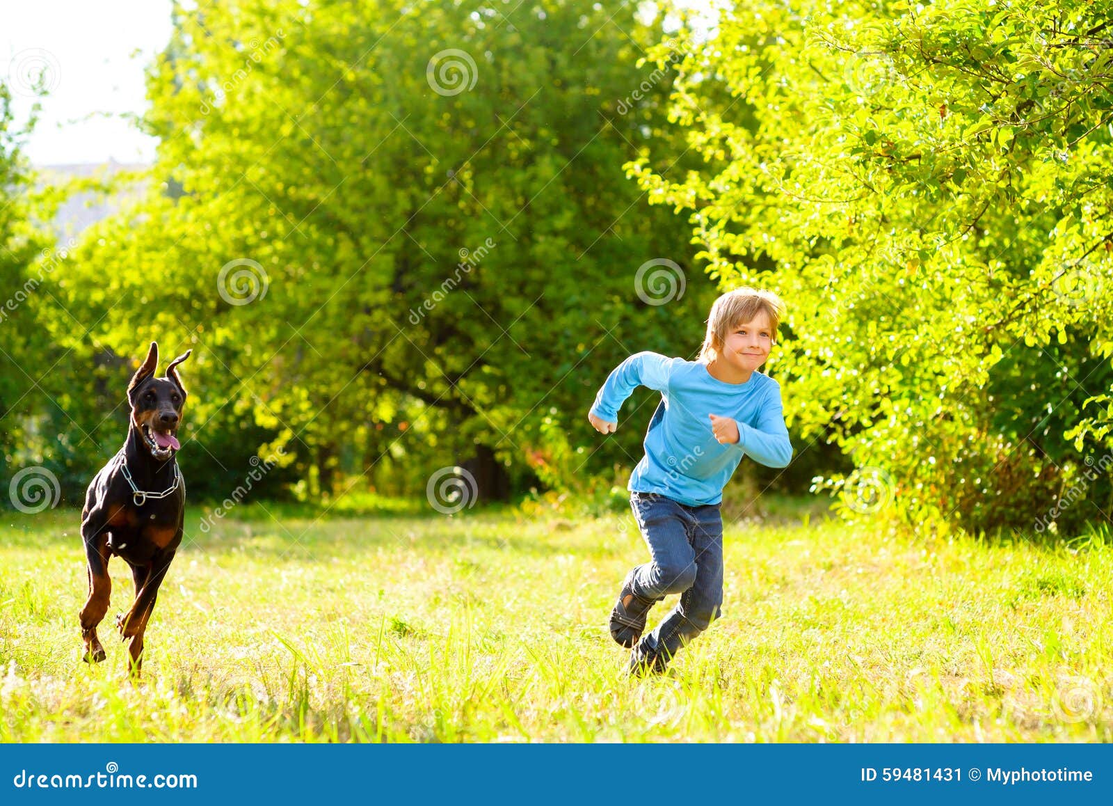 Boy Running Away From Dog Or Doberman In Summer Royalty-Free Stock ...