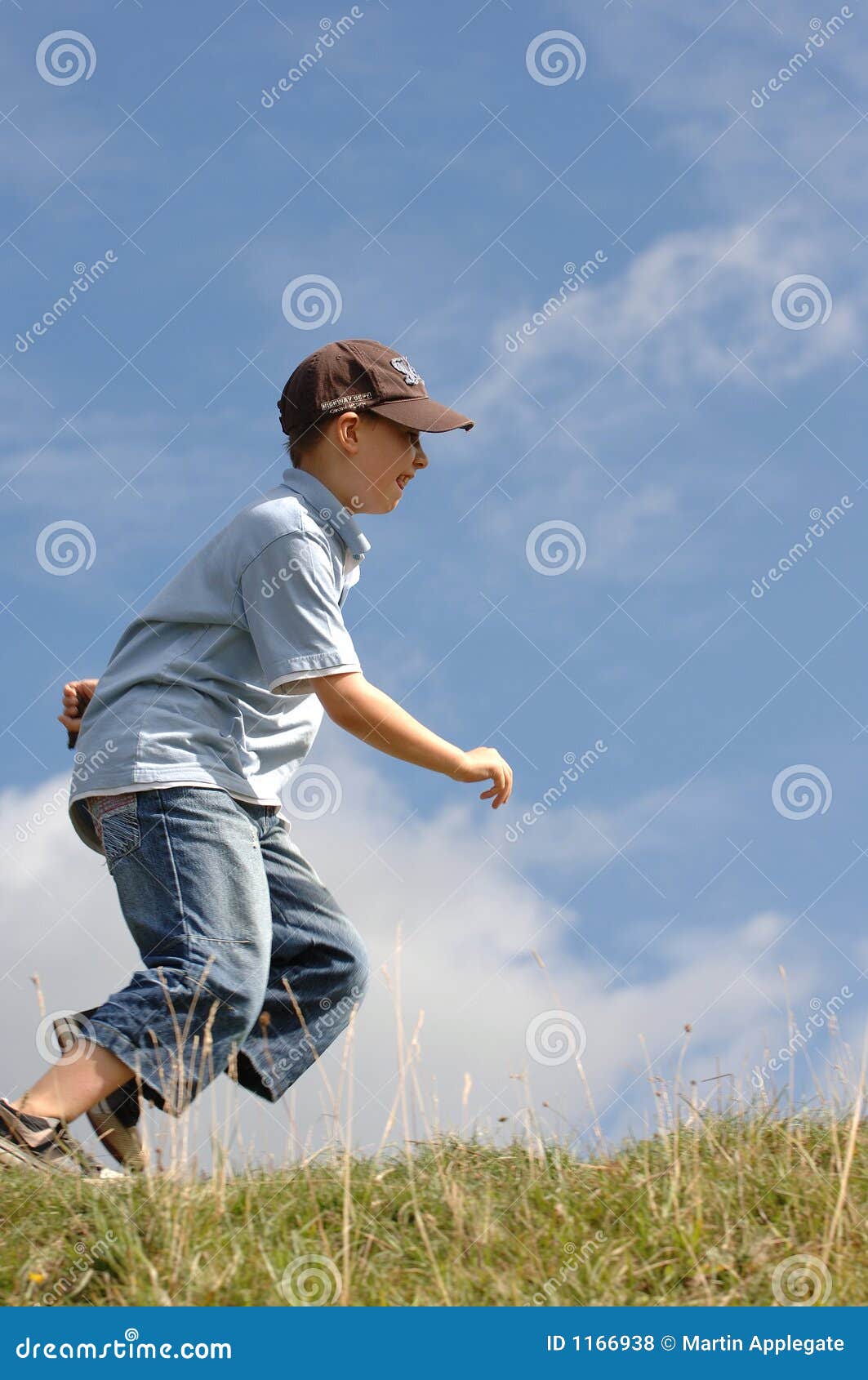A boy running in grass stock photo. Image of fitness, quick - 1166938