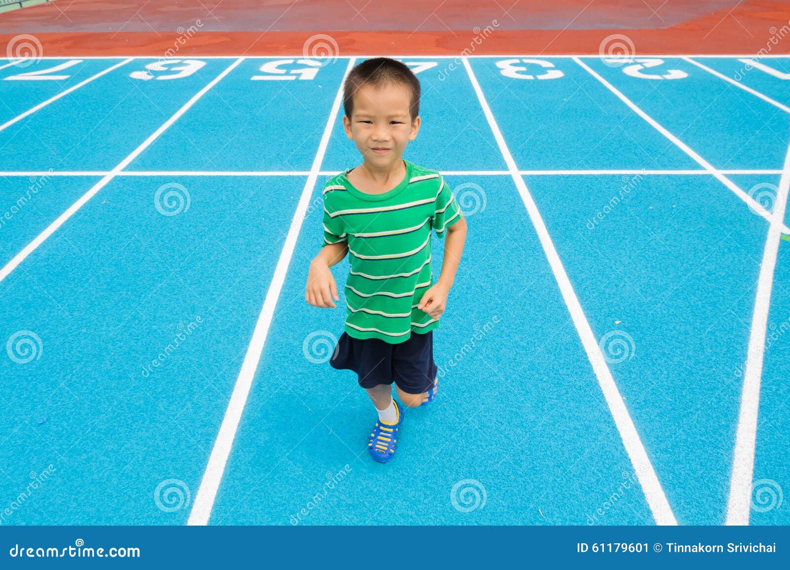 Boy running on racetrack stock image. Image of strong - 61179601