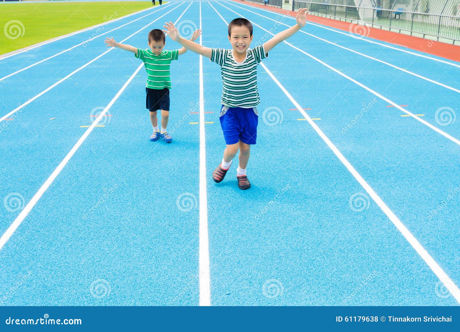 Boy running on racetrack stock photo. Image of track - 61179638