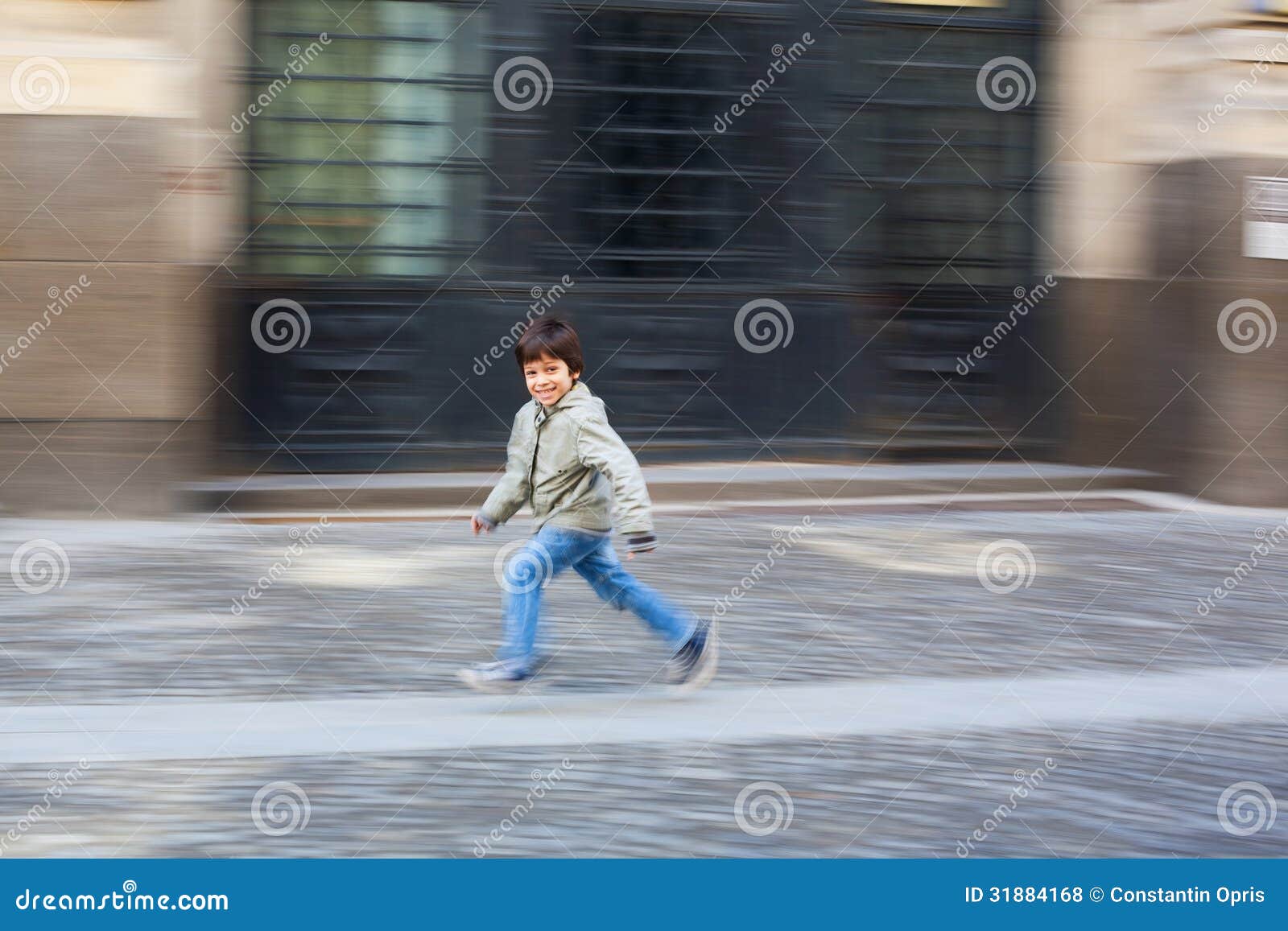 Boy running on street stock photo. Image of childhood - 31884168