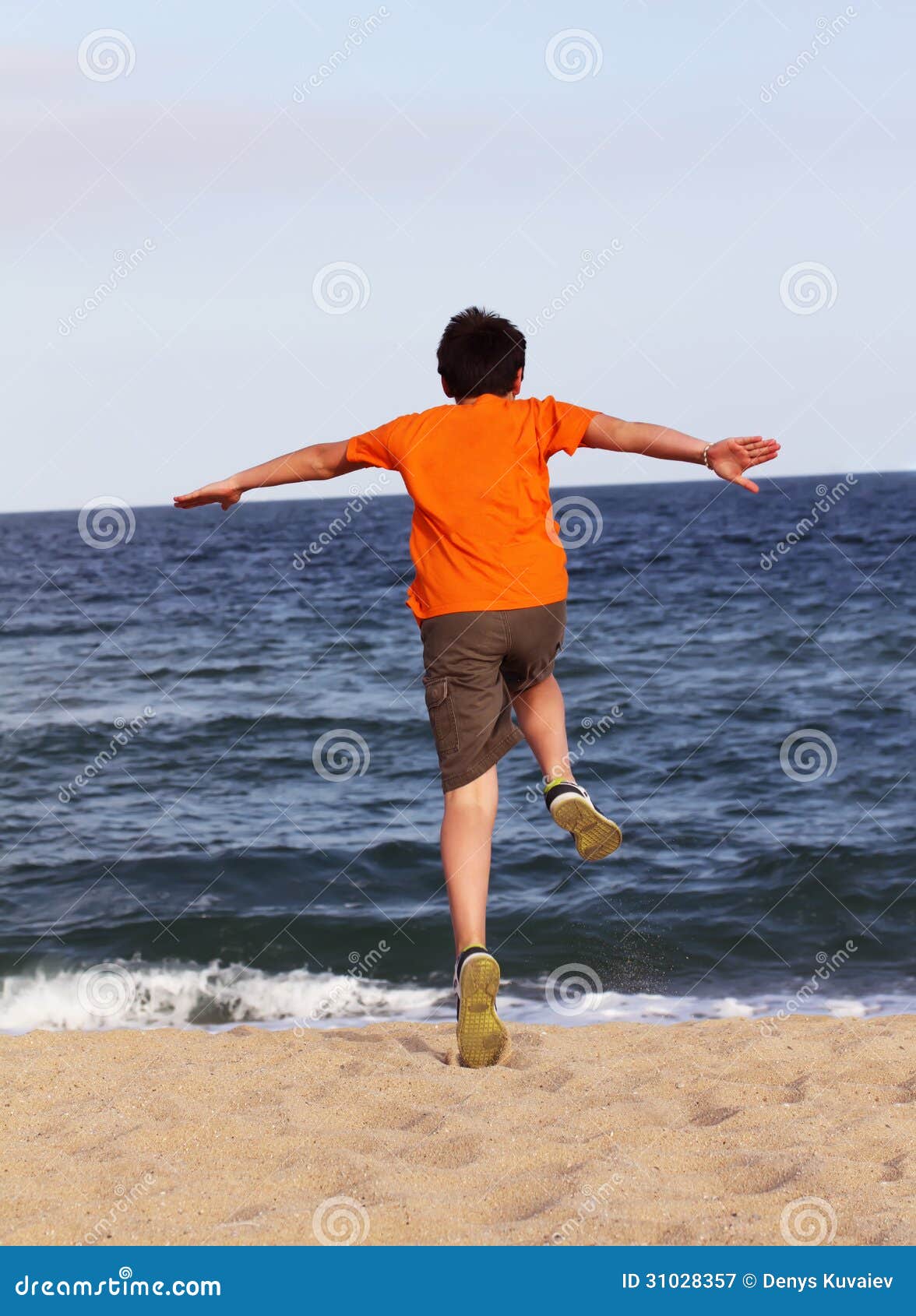 Boy running to the sea stock image. Image of energy, lifestyle - 31028357