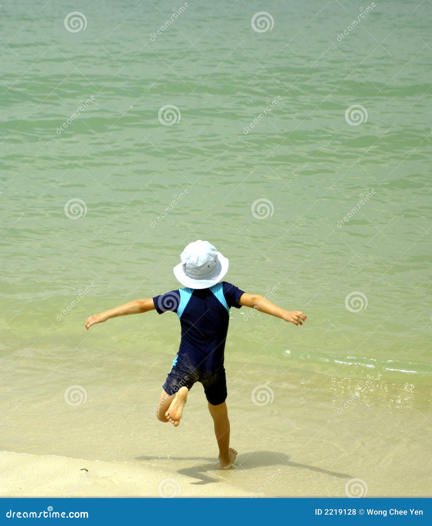 Boy running into water stock photo. Image of flying, play - 2219128