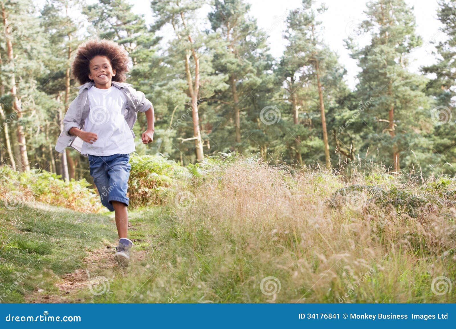 Boy Running through Woods stock image. Image of path - 34176841