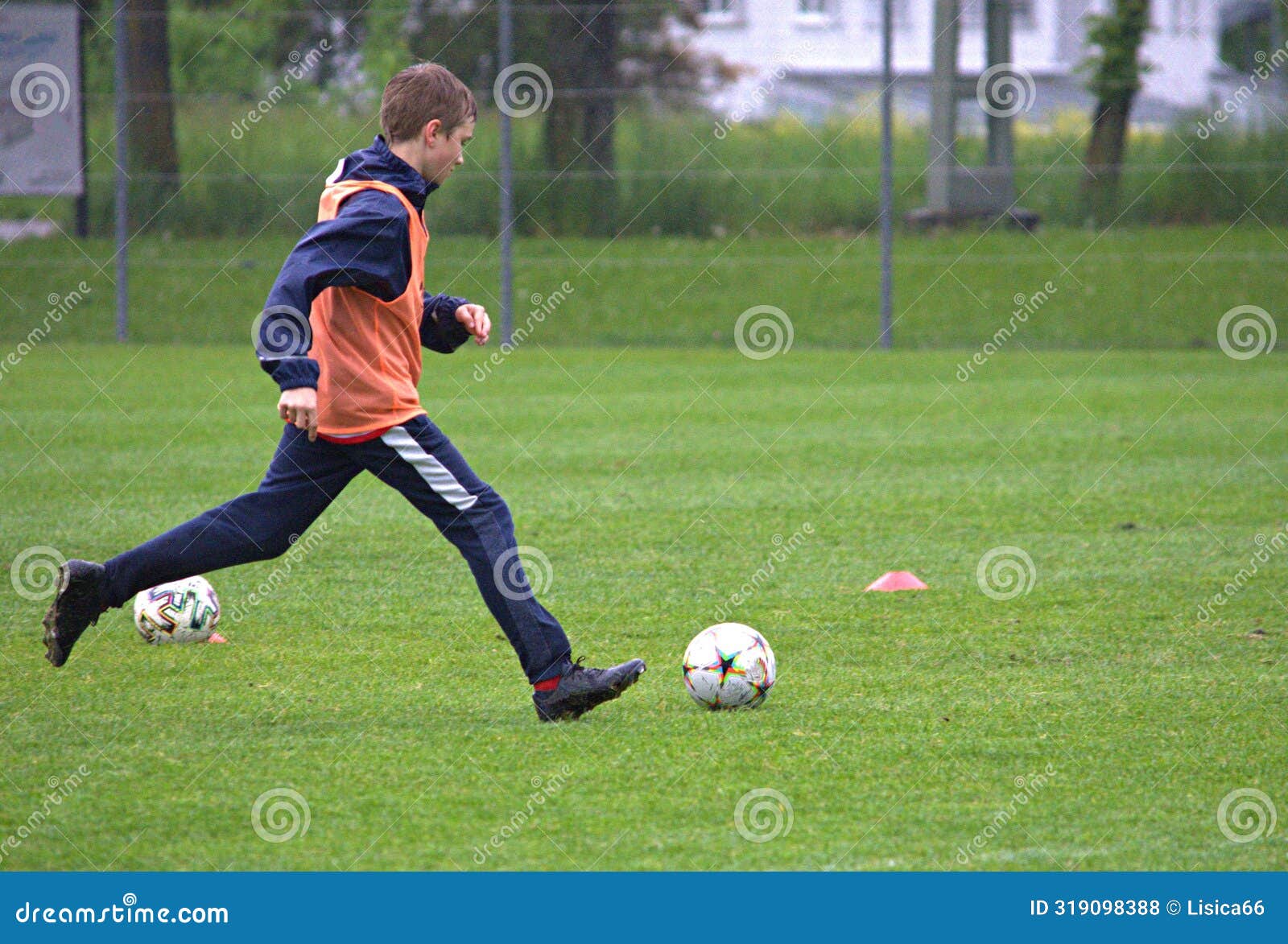The Boy Runs Along the Football Field Stock Photo - Image of childhood ...