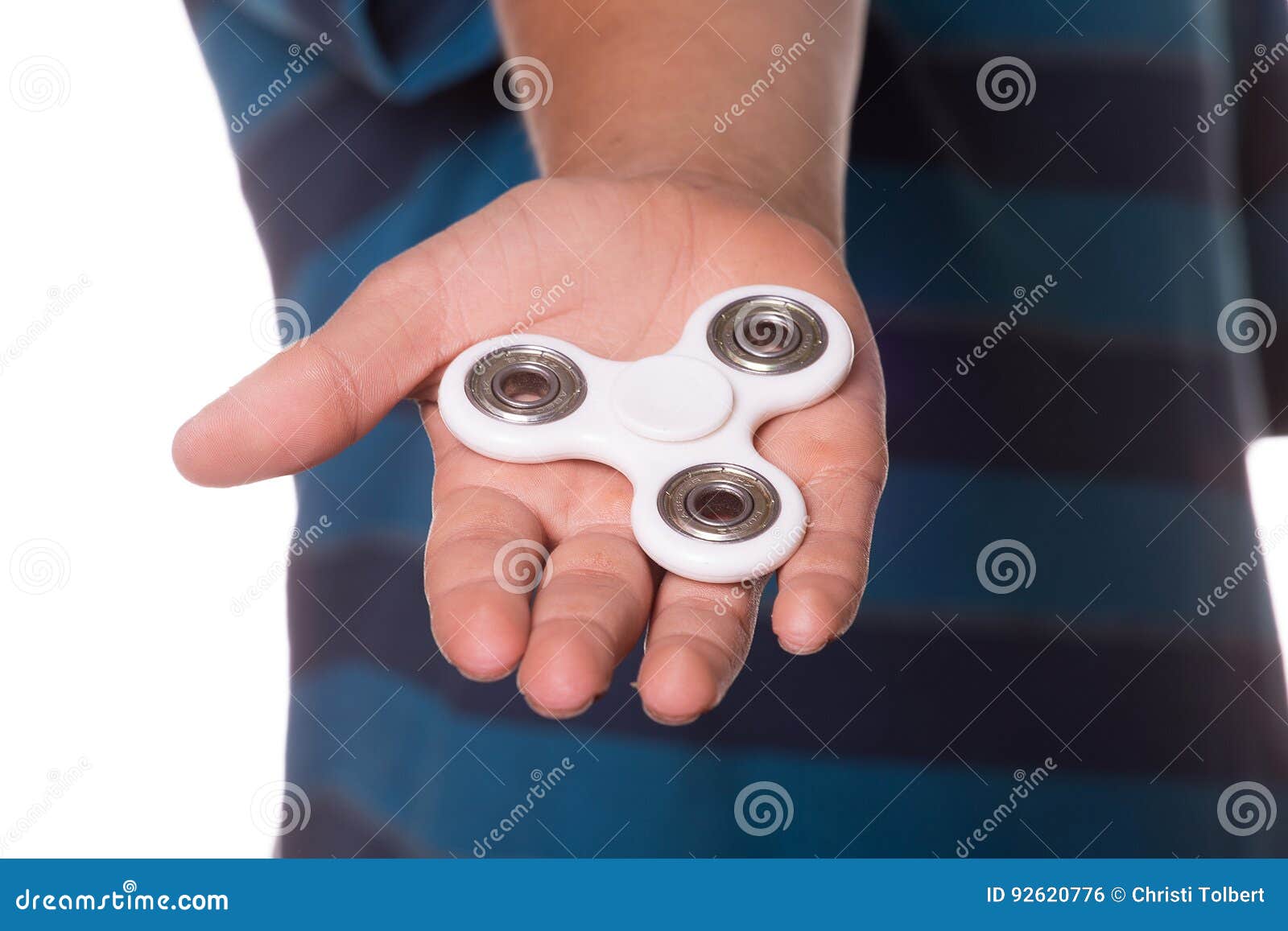 Boy`s Hand Holding Fidget Spinner Stock Photo - Image of background ...