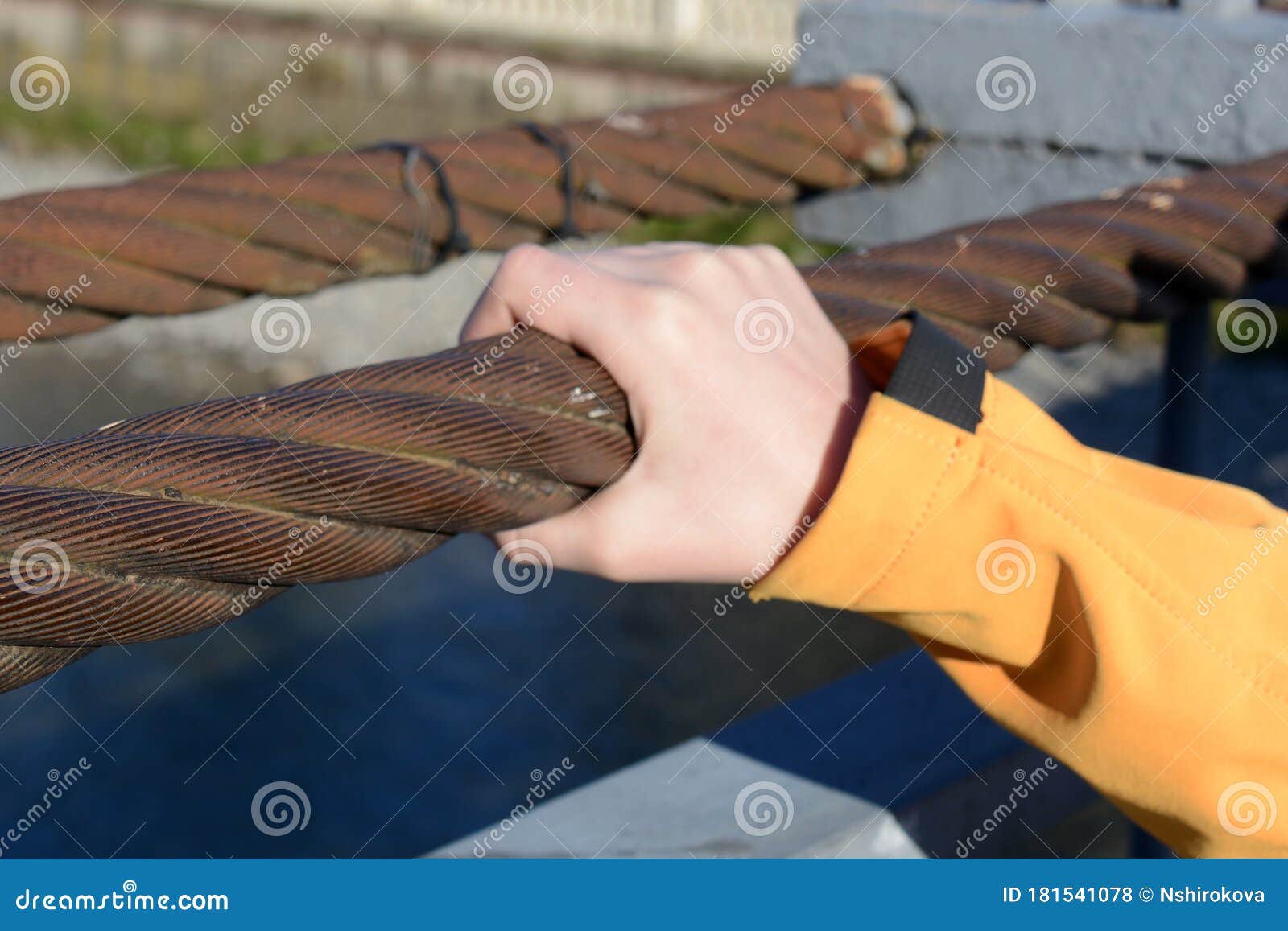 Boy`s Hand Holding the Rusty Wire Rope Bridge Stock Photo - Image of ...
