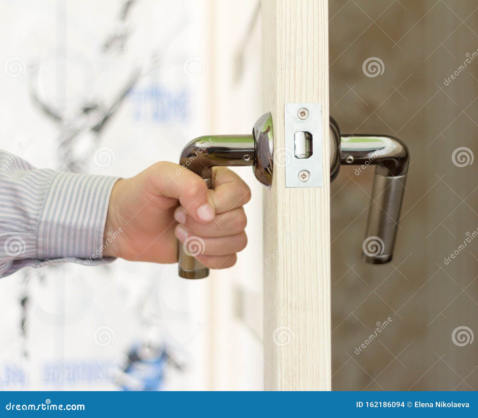 The Boy`s Hand Holds the Handle of the Door Opening,exit or Entrance To ...