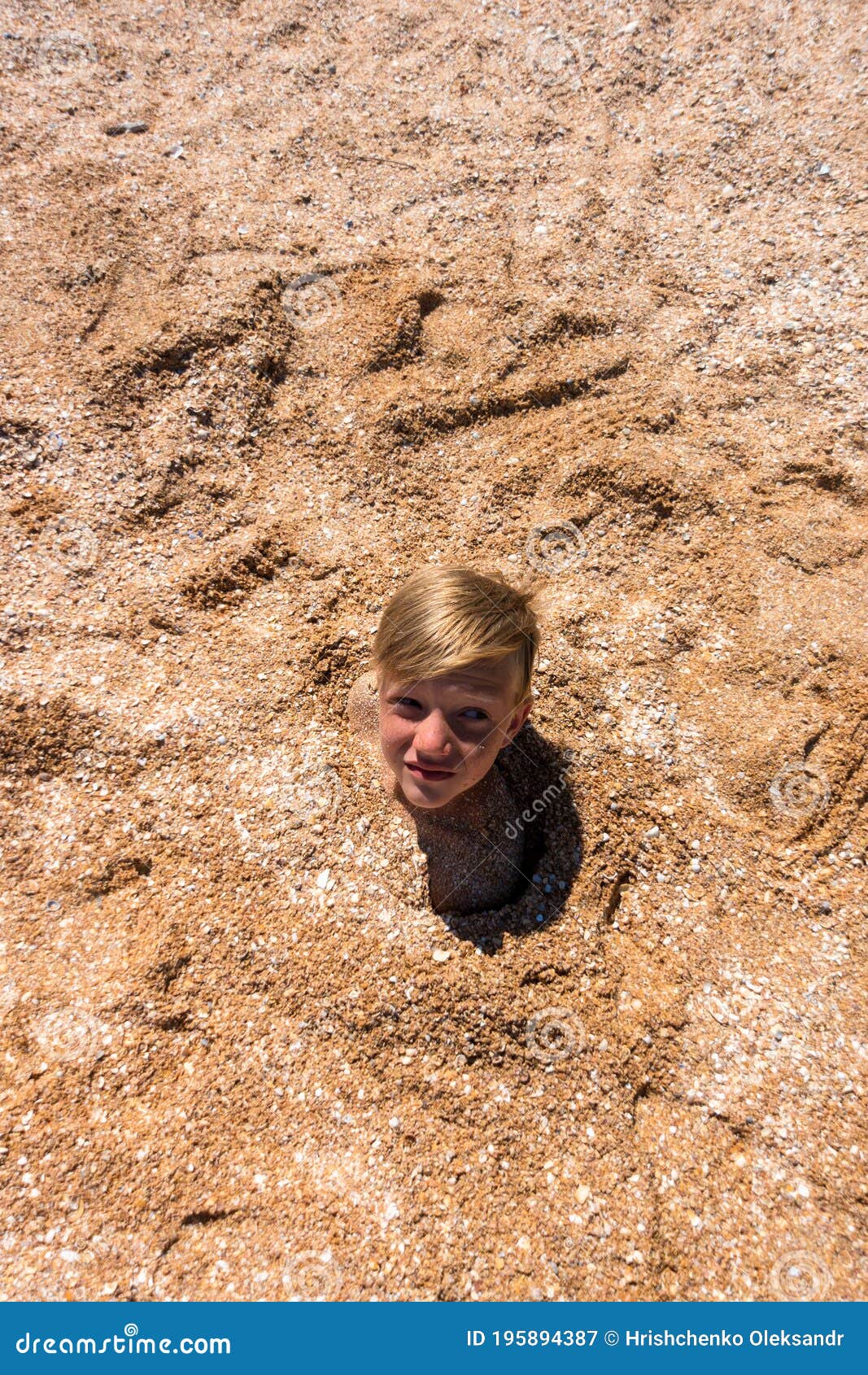 The Boy`s Head is Sticking Out of the Sand Stock Image - Image of ...