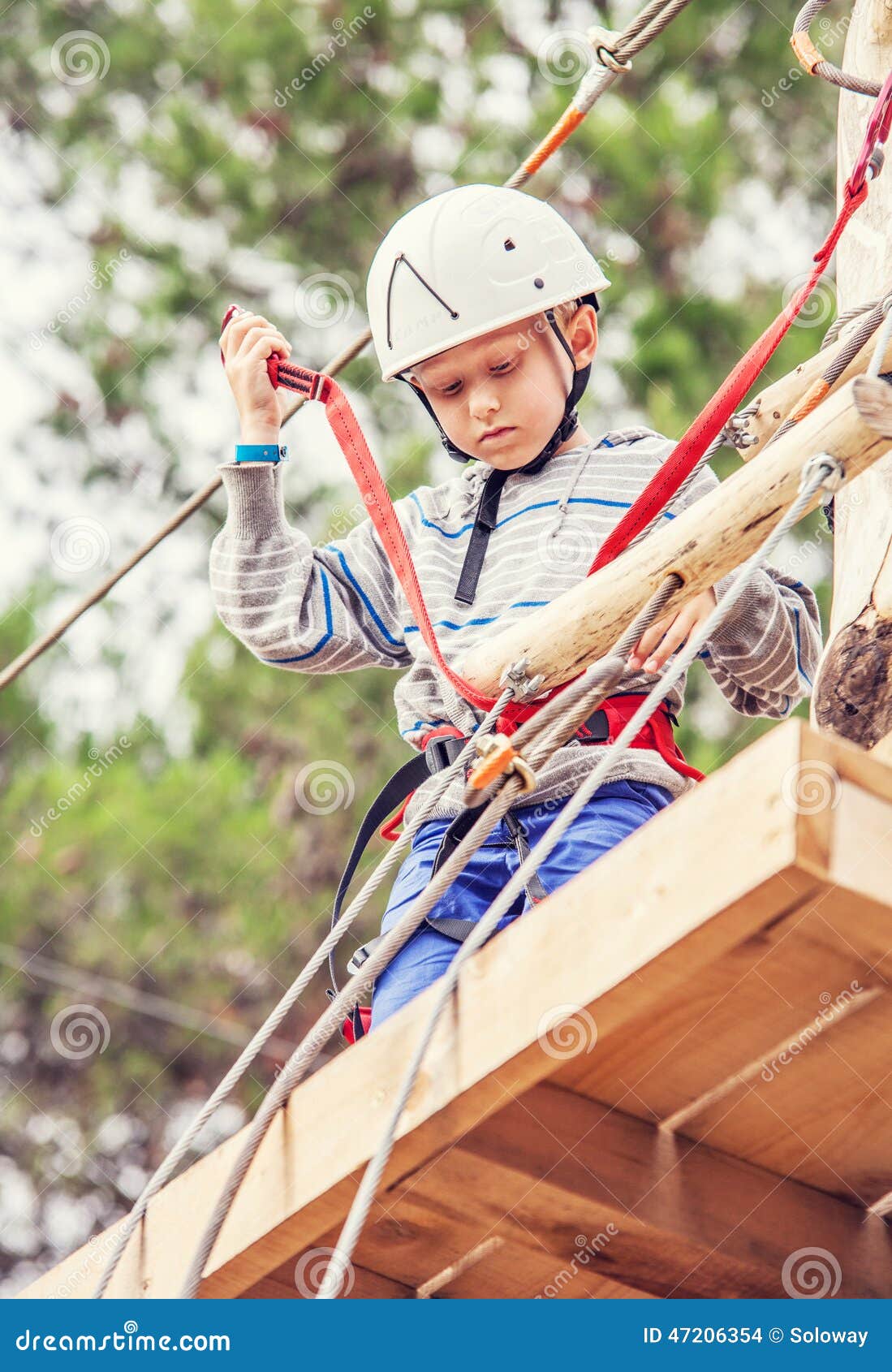 Boy in Safe Equipment on the Rope Track Stock Photo - Image of child ...
