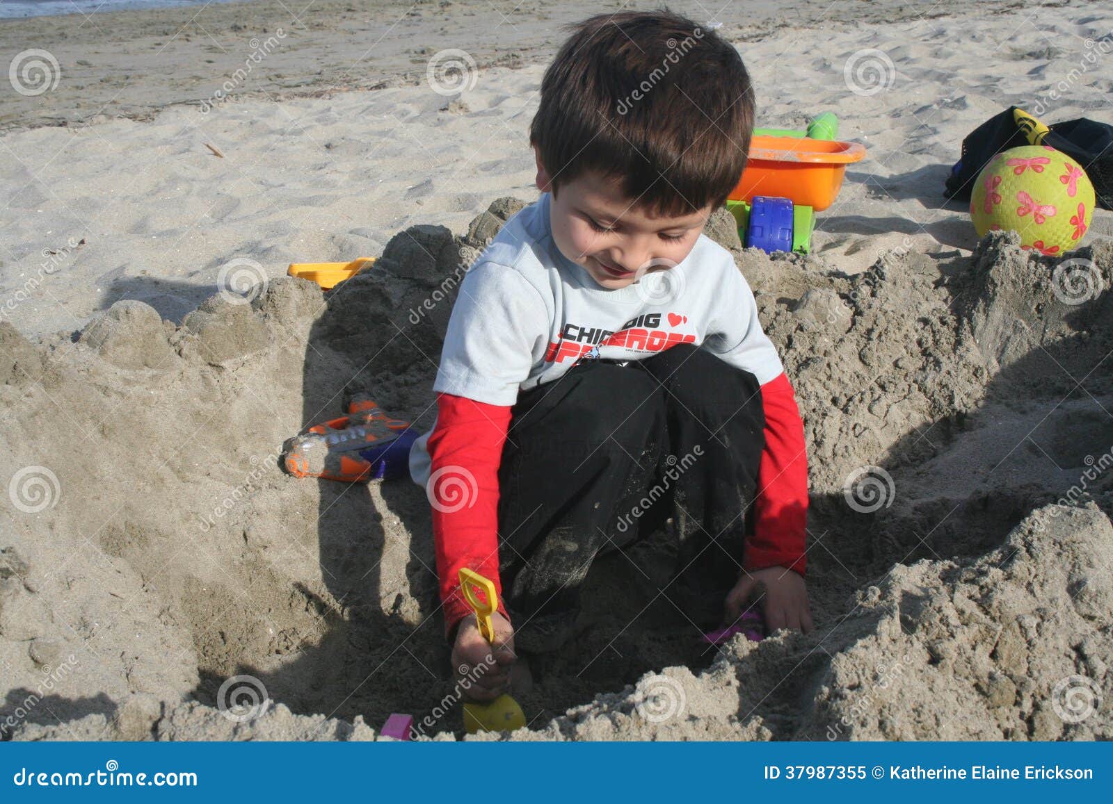 Boy in sand stock image. Image of digging, destination - 37987355