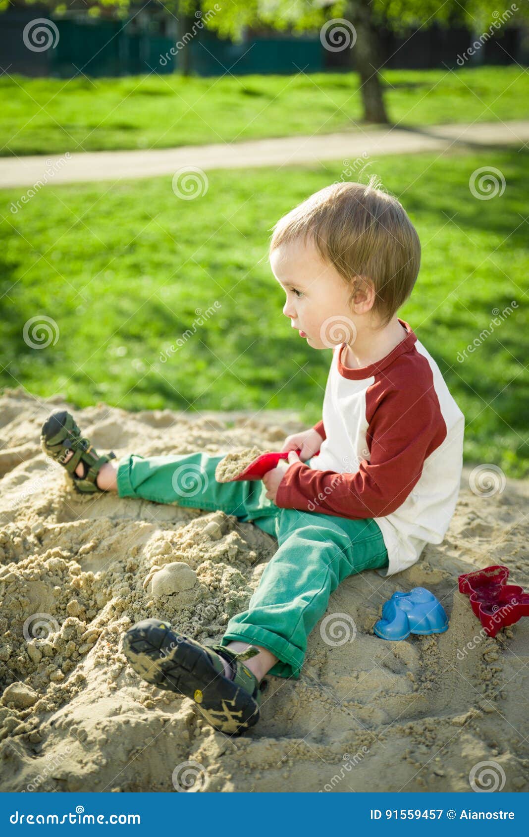 Boy and sand stock image. Image of bucket, jeans, caucasian - 91559457