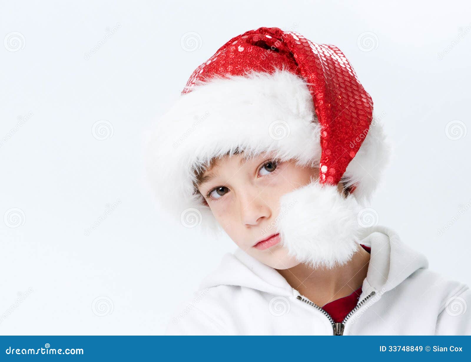 Boy in a santa hat stock image. Image of cute, looking - 33748849