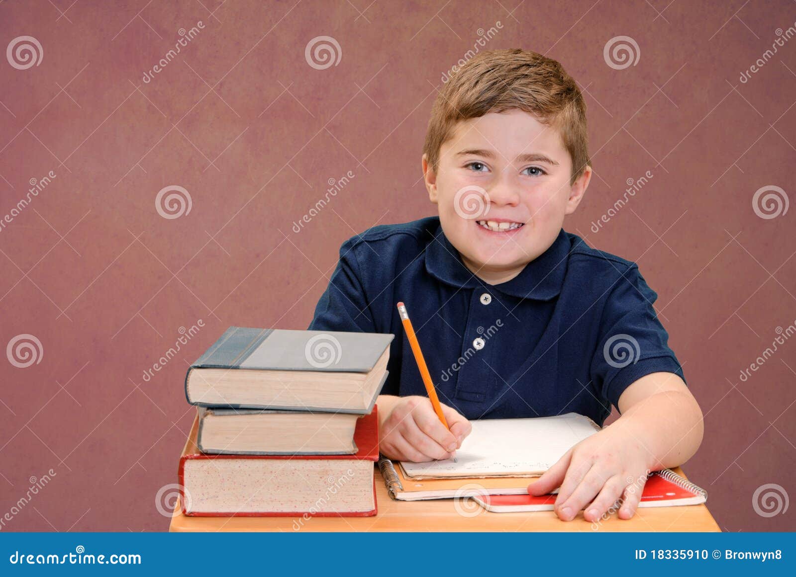Boy at School Desk stock photo. Image of paper, student - 18335910