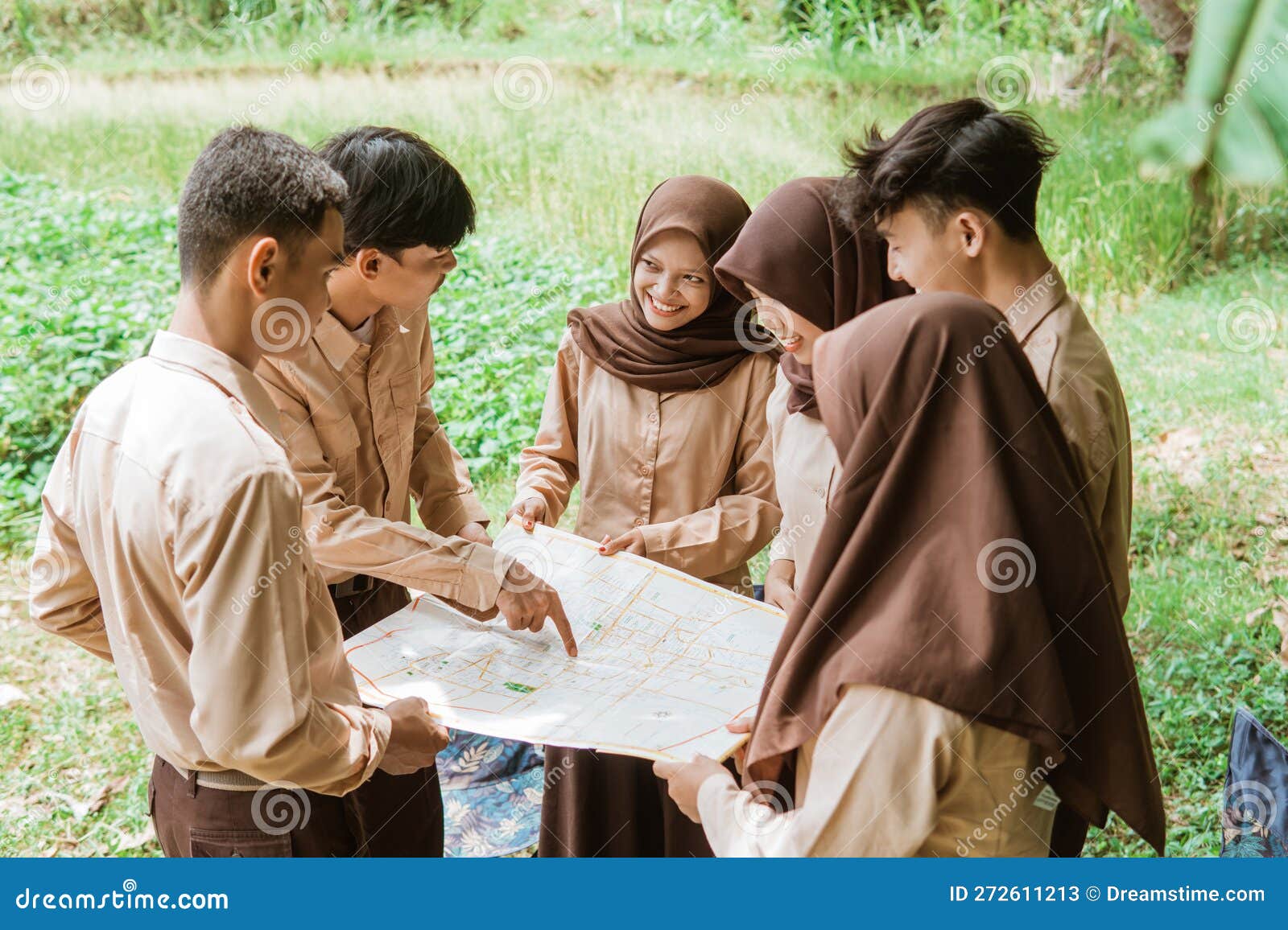 Boy Scout with Finger Pointing at Map with Group Mates Stock Image ...