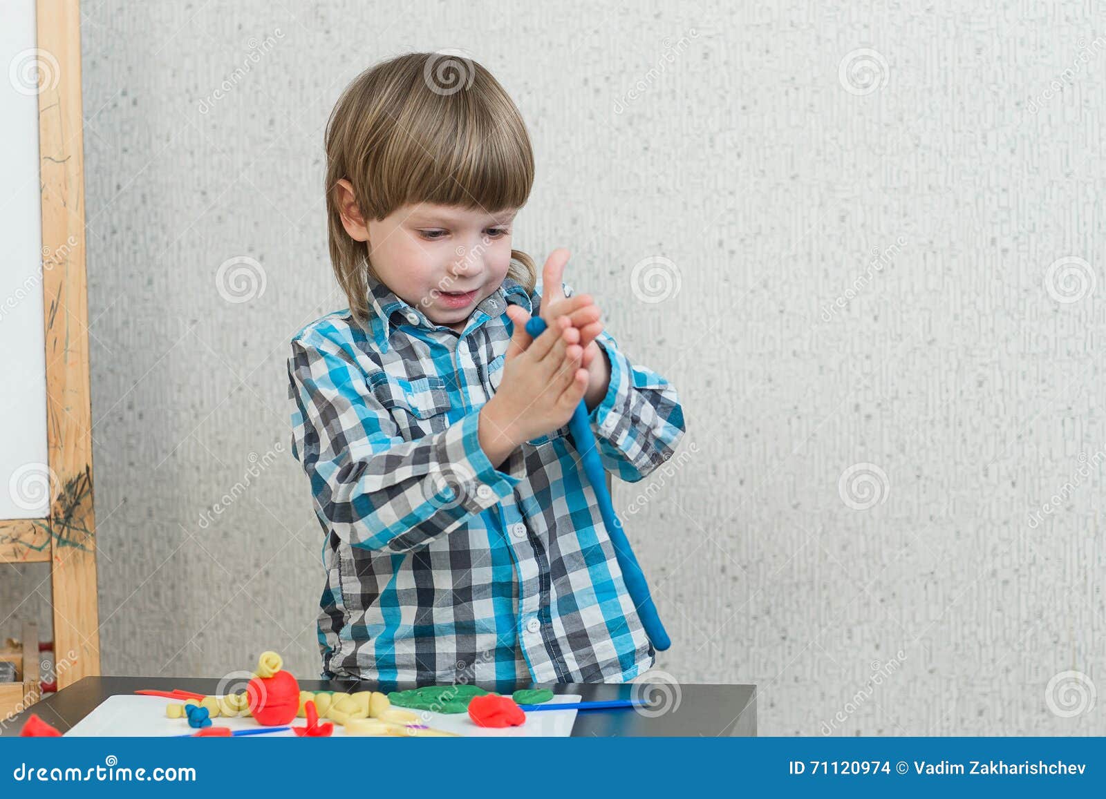 Boy Sculpts from Plasticine at Home Stock Photo - Image of mold, clay ...