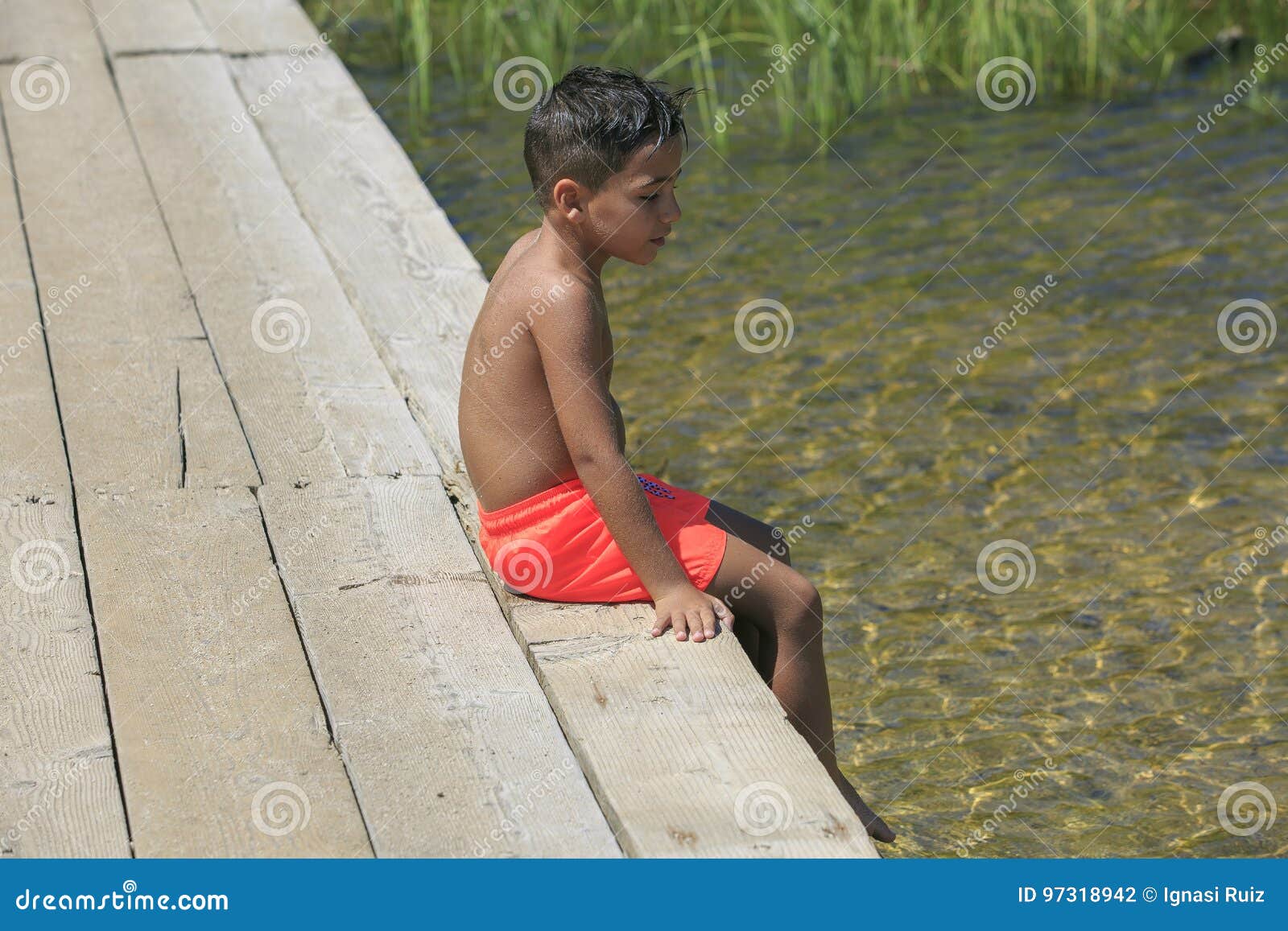 Boy Seating on a Wooden Foot Bridge on a Lake Stock Photo - Image of ...