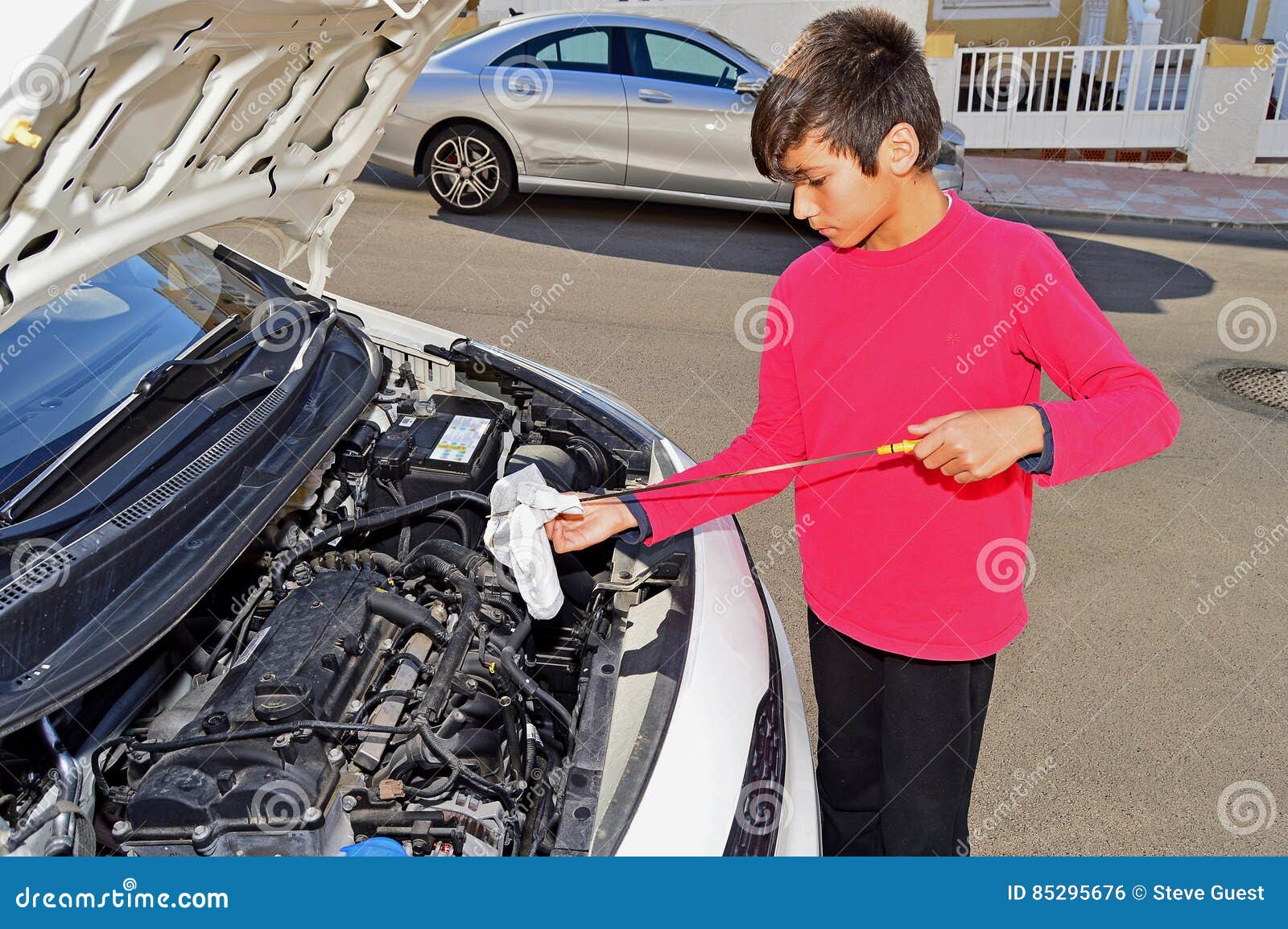Boy Servicing a Car stock photo. Image of motoring, cloth - 85295676