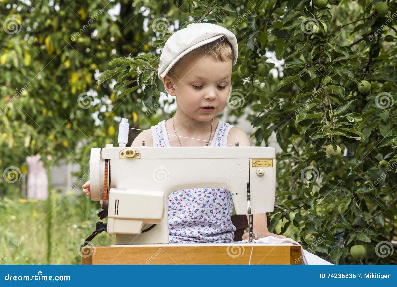 Boy Sews on the Sewing Machine Stock Photo - Image of nature, machine ...