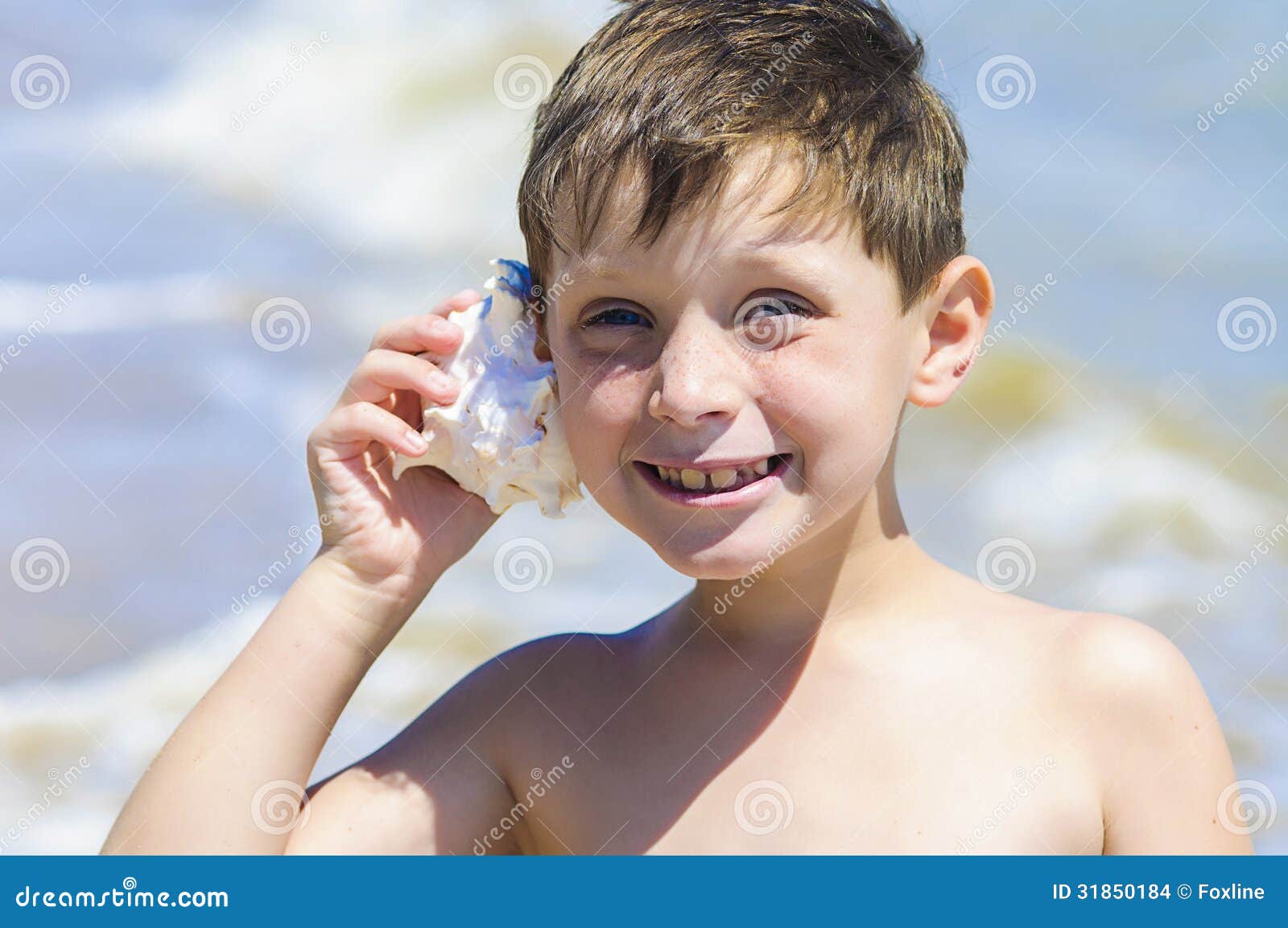 Boy with Shell in Hand on the Beach Stock Photo - Image of sand ...