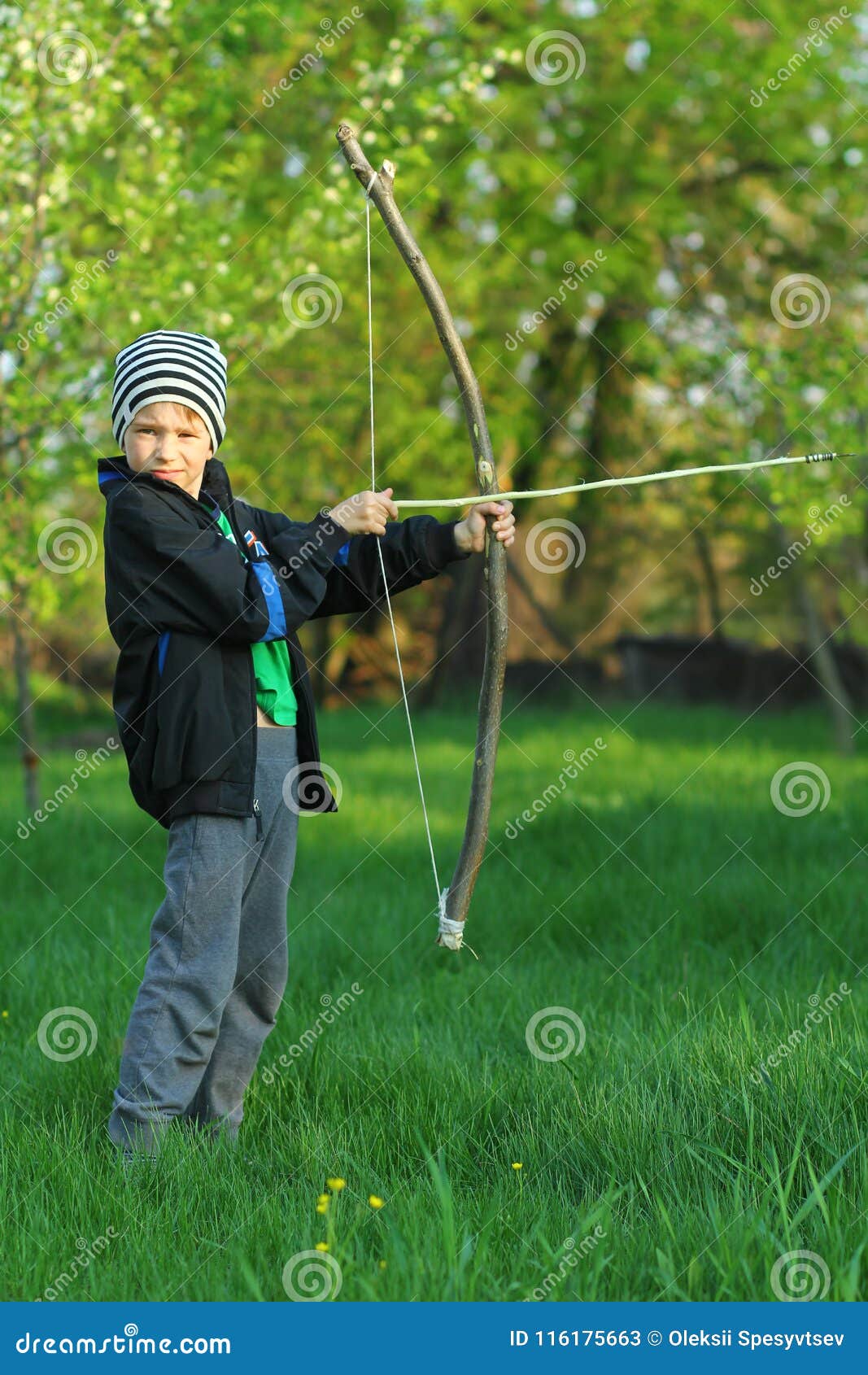 Boy Shooting with a Hand Made Bow and Arrow. Stock Image - Image of ...