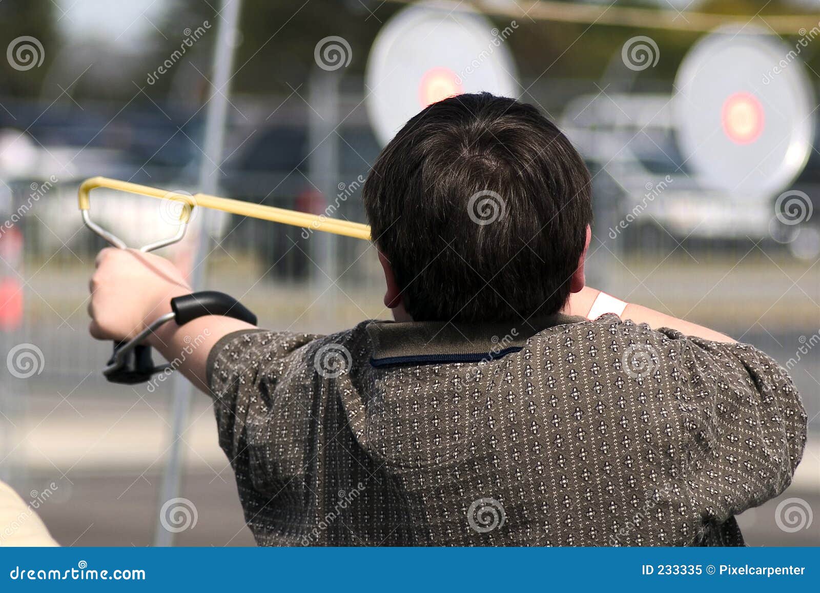 Boy shooting sling shot stock image. Image of slingshot - 233335