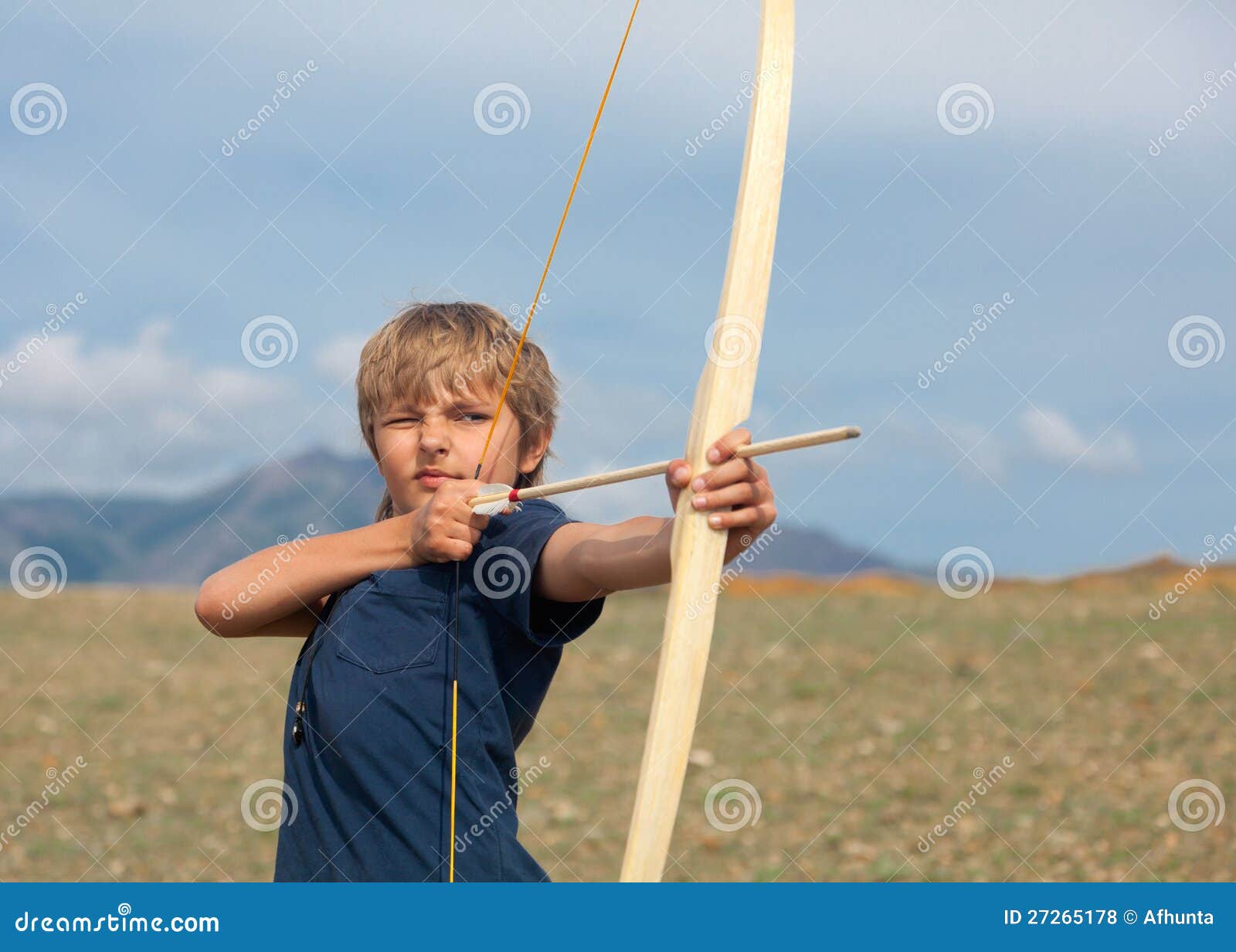 Boy Shoots a Bow at a Target Stock Photo - Image of hitting, archery ...
