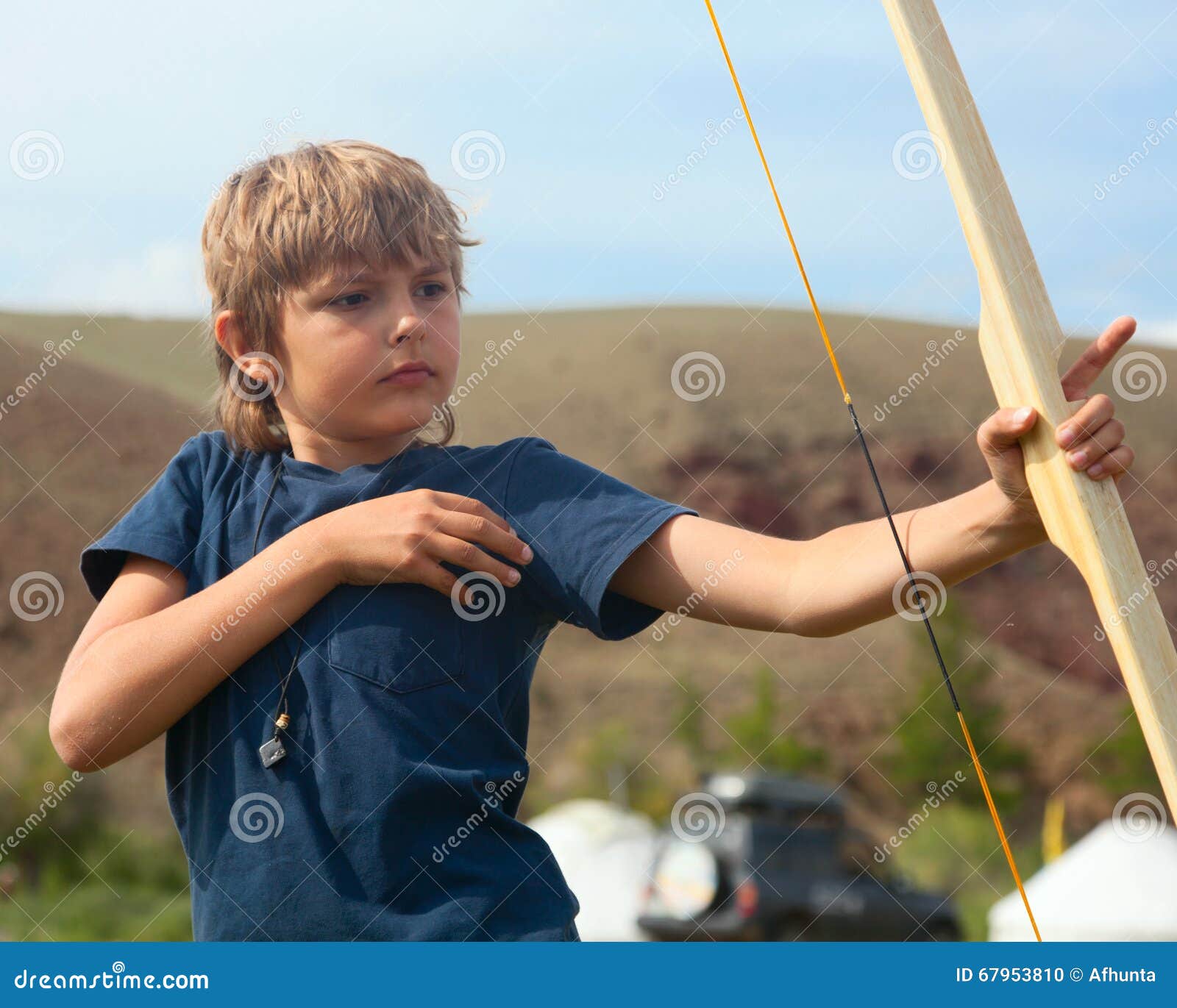 Boy Shoots a Bow at a Target Stock Photo - Image of caucasian, child ...