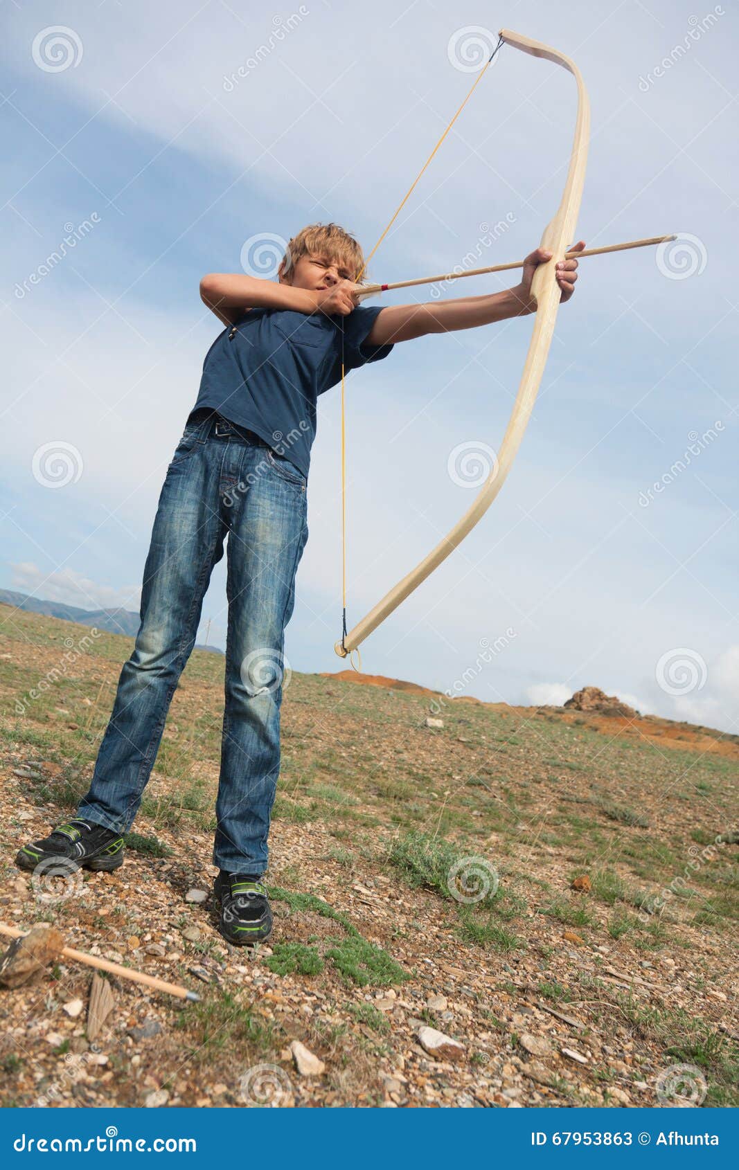 Boy Shoots a Bow at a Target Stock Image - Image of shooter, child ...