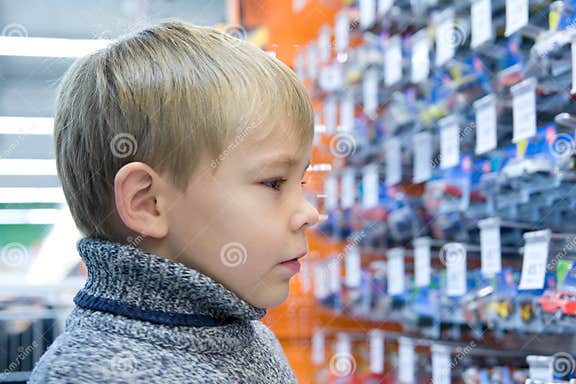 Boy in shop stock image. Image of portrait, male, choosing - 11460697