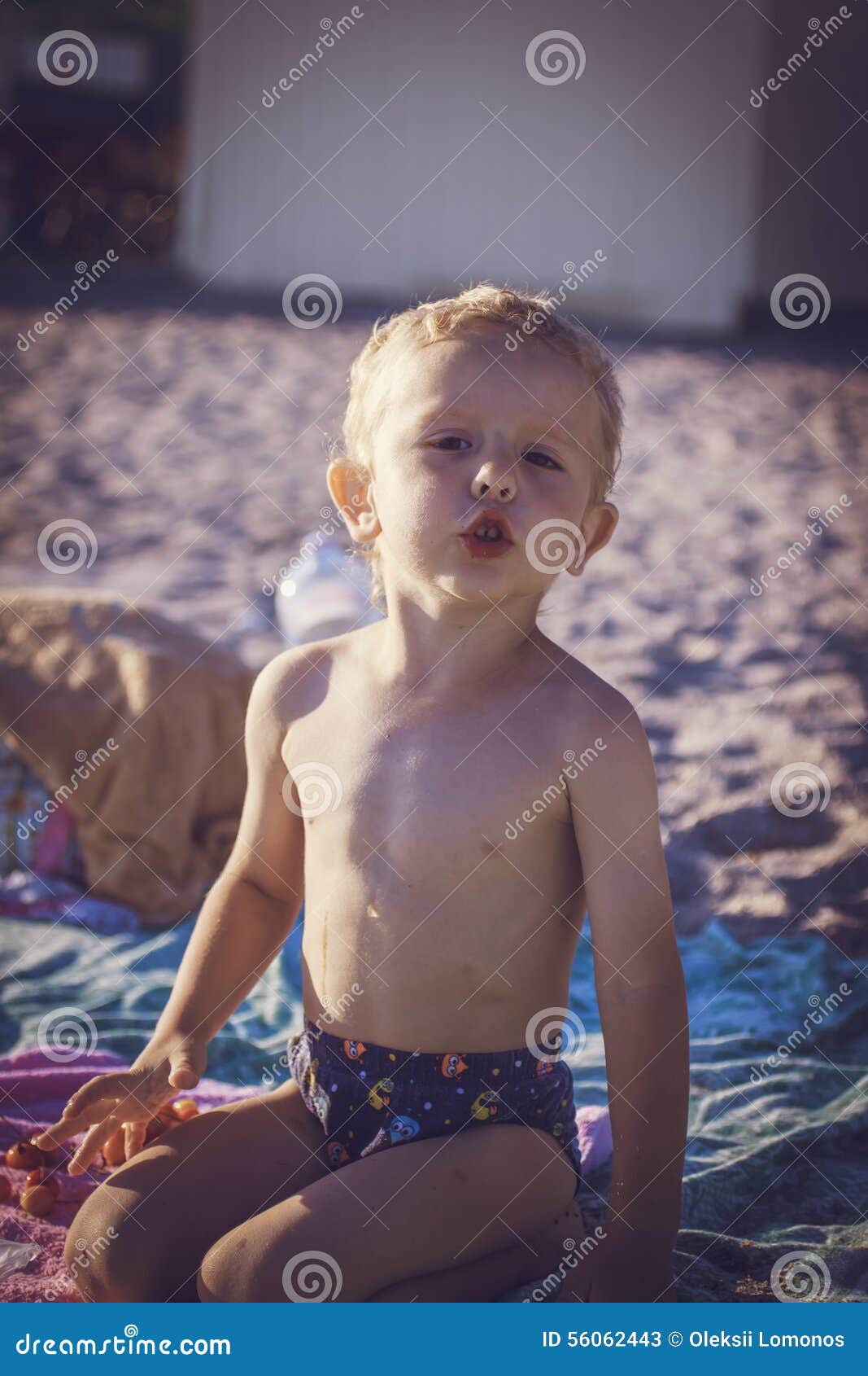 Boy in Shorts Sitting on the Beach Stock Image - Image of beach, shorts ...