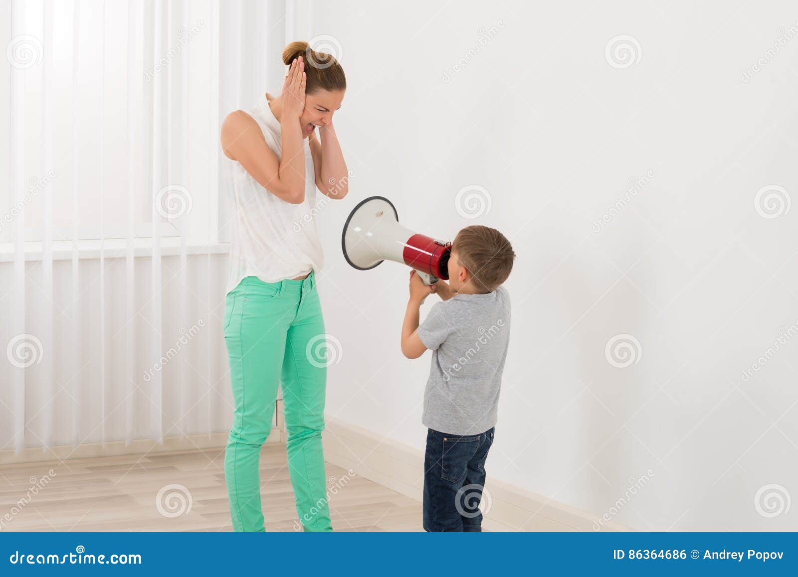 Boy Shouting at Her Mother stock photo. Image of megaphone - 86364686