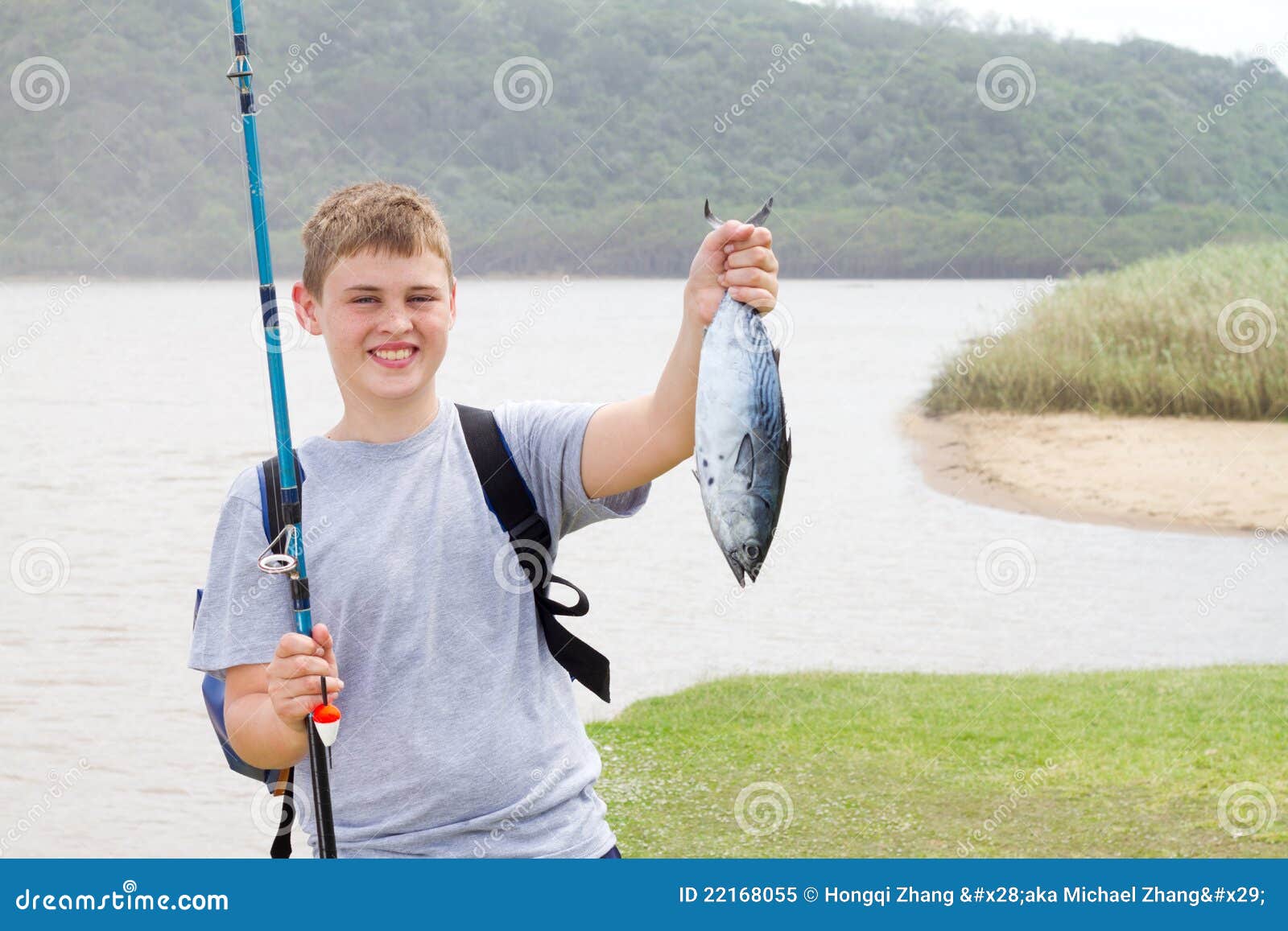 Boy showing a fish stock image. Image of preteen, carefree - 22168055