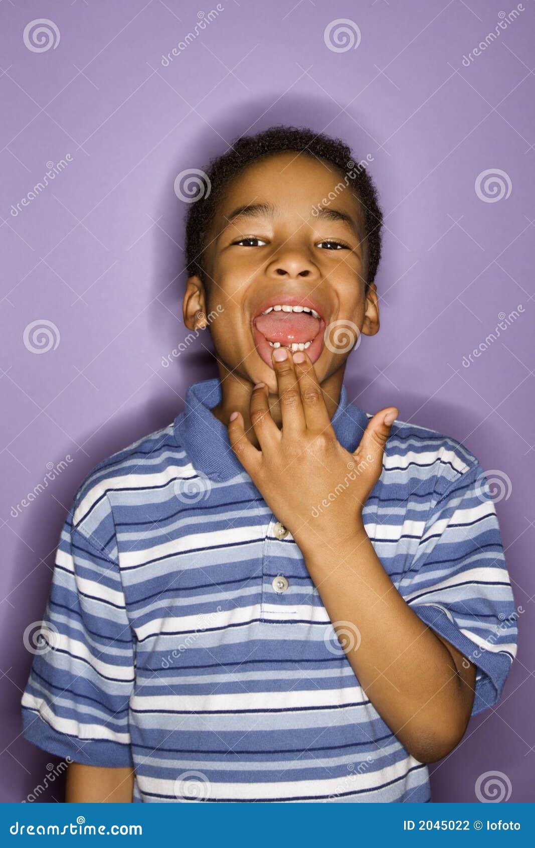Boy showing his teeth. stock photo. Image of tooth, person - 2045022