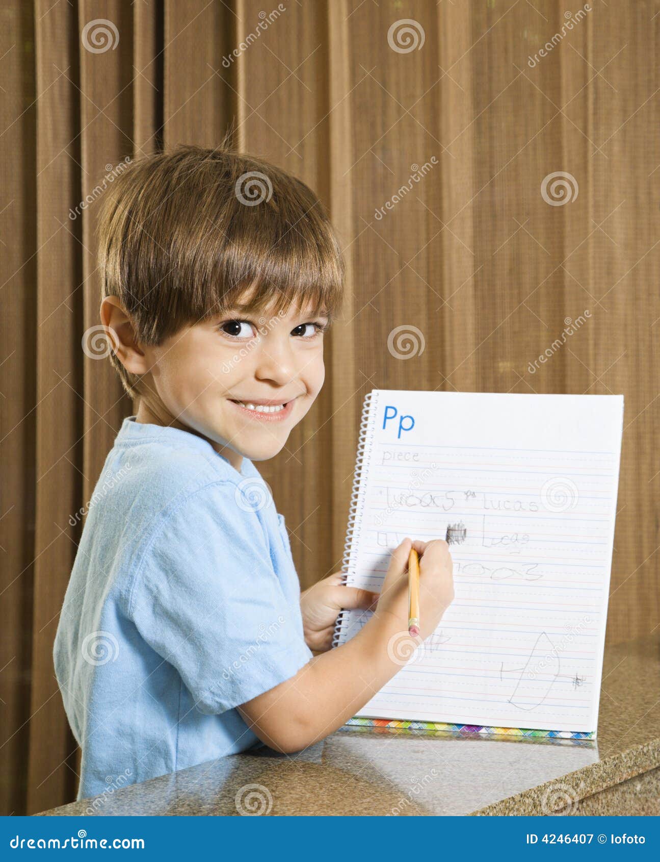 Boy showing homework. stock image. Image of people, domestic - 4246407