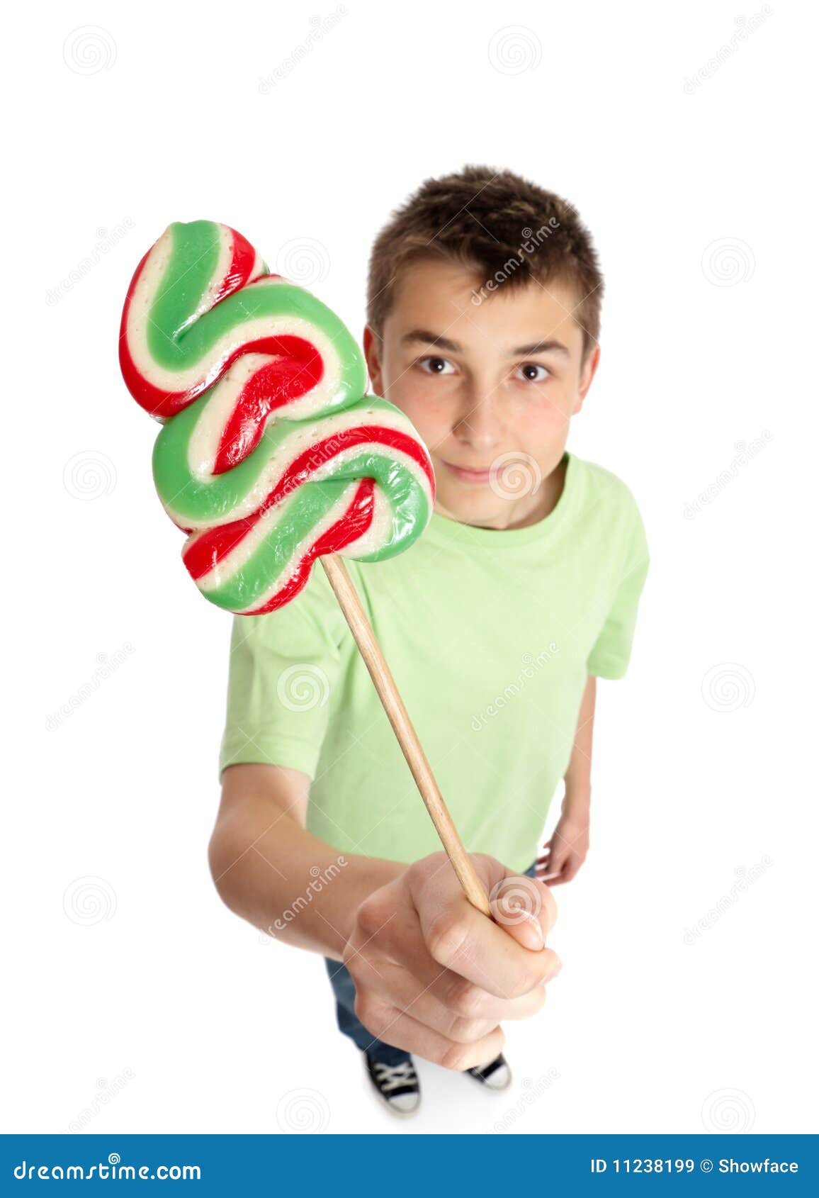 Boy showing lollipop candy stock image. Image of body - 11238199