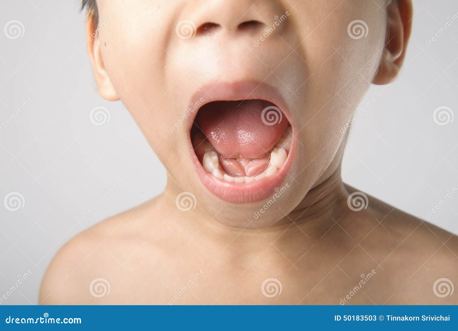Boy showing teeth stock image. Image of teeth, grow, studio - 50183503