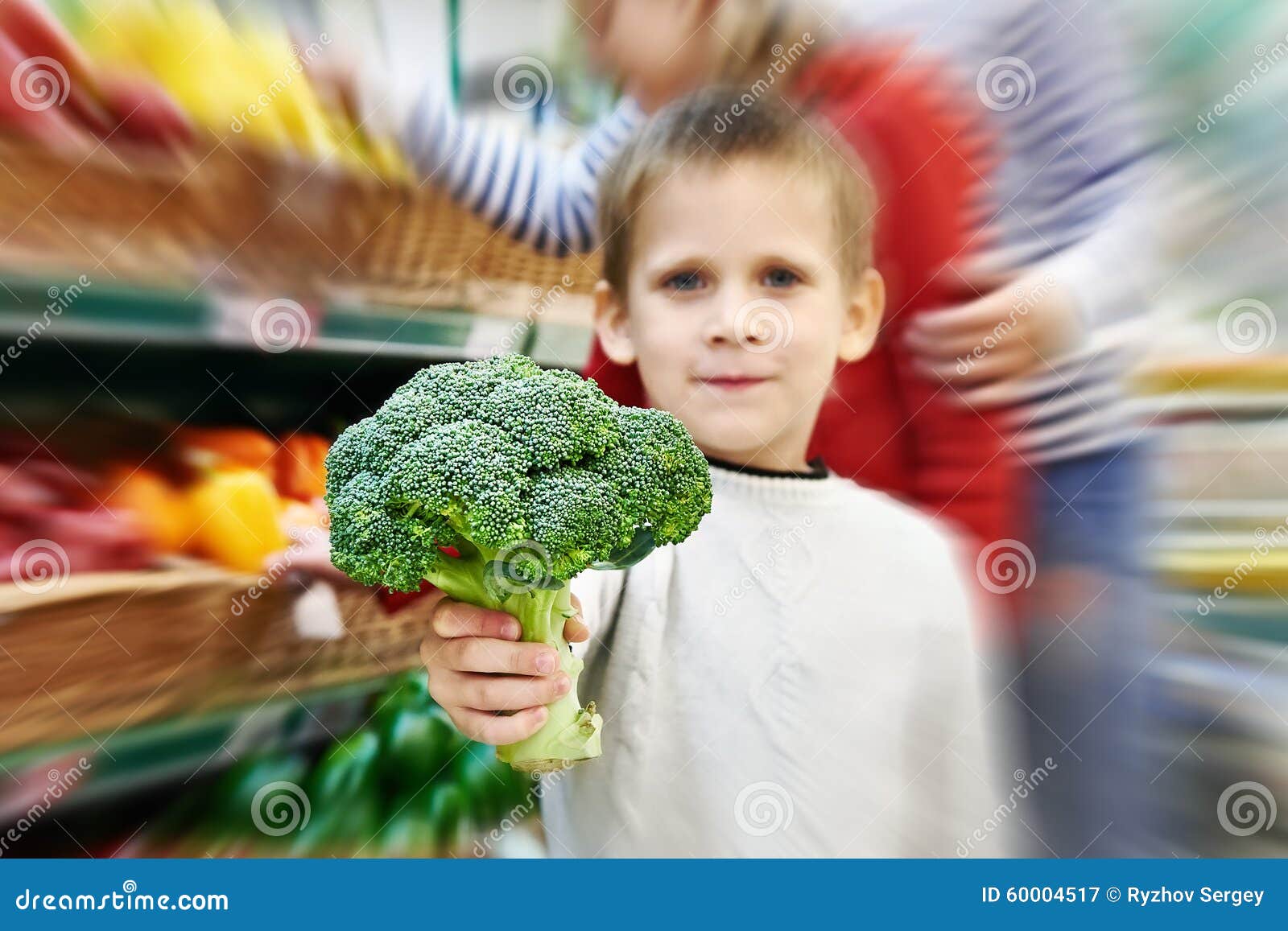 Boy shows broccoli stock image. Image of nutritious, market - 60004517