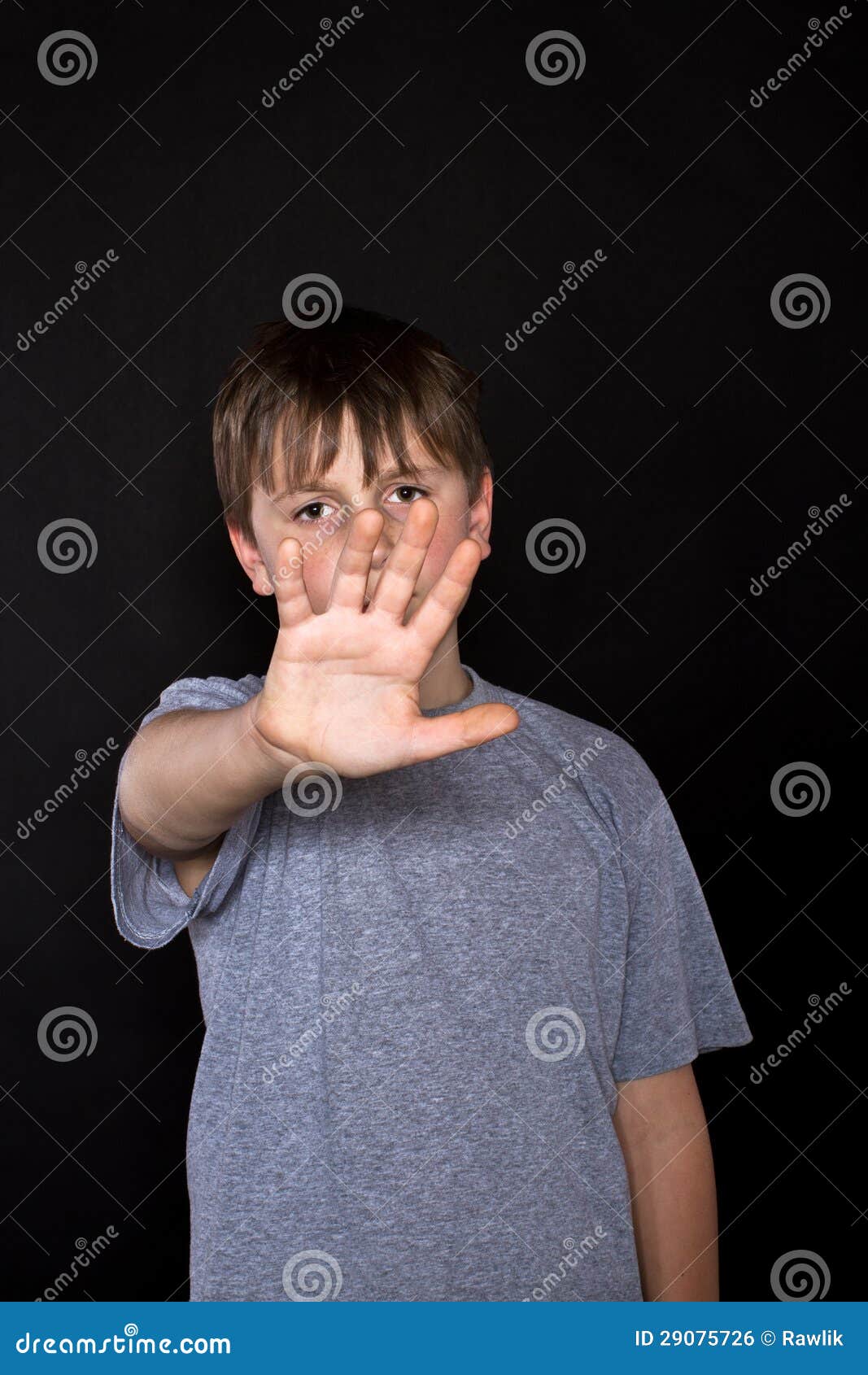 Boy shows his hand to stop stock photo. Image of male - 29075726