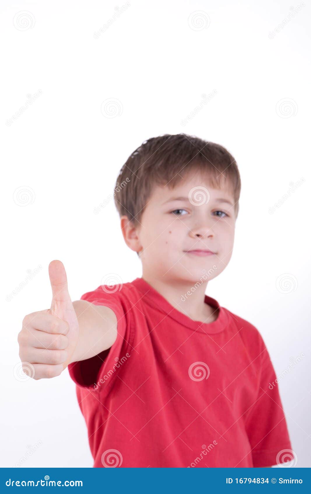 The boy shows a sign stock photo. Image of smile, thumb - 16794834